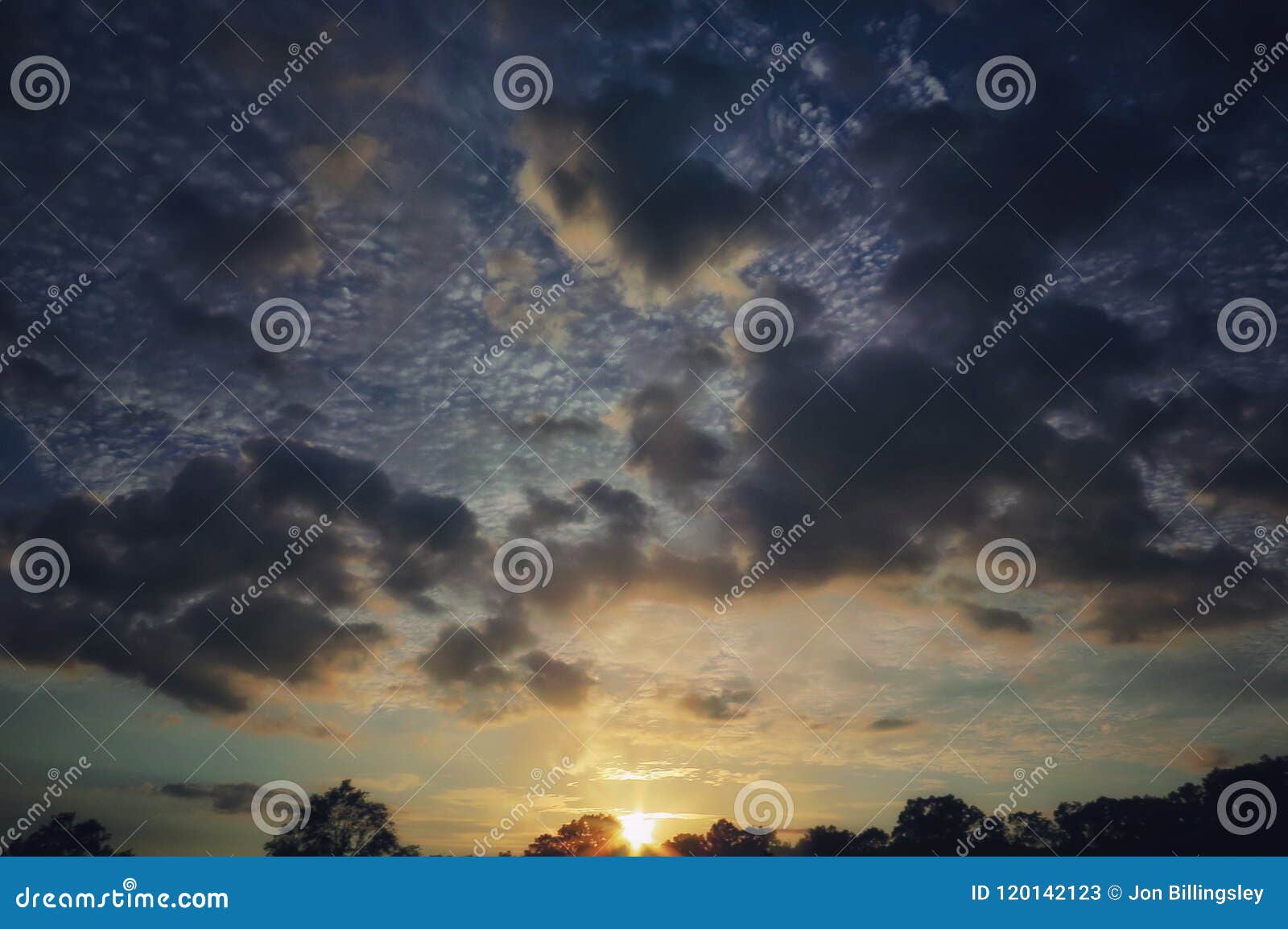 Clouded Summer Sunset stock image. Image of clouded - 120142123