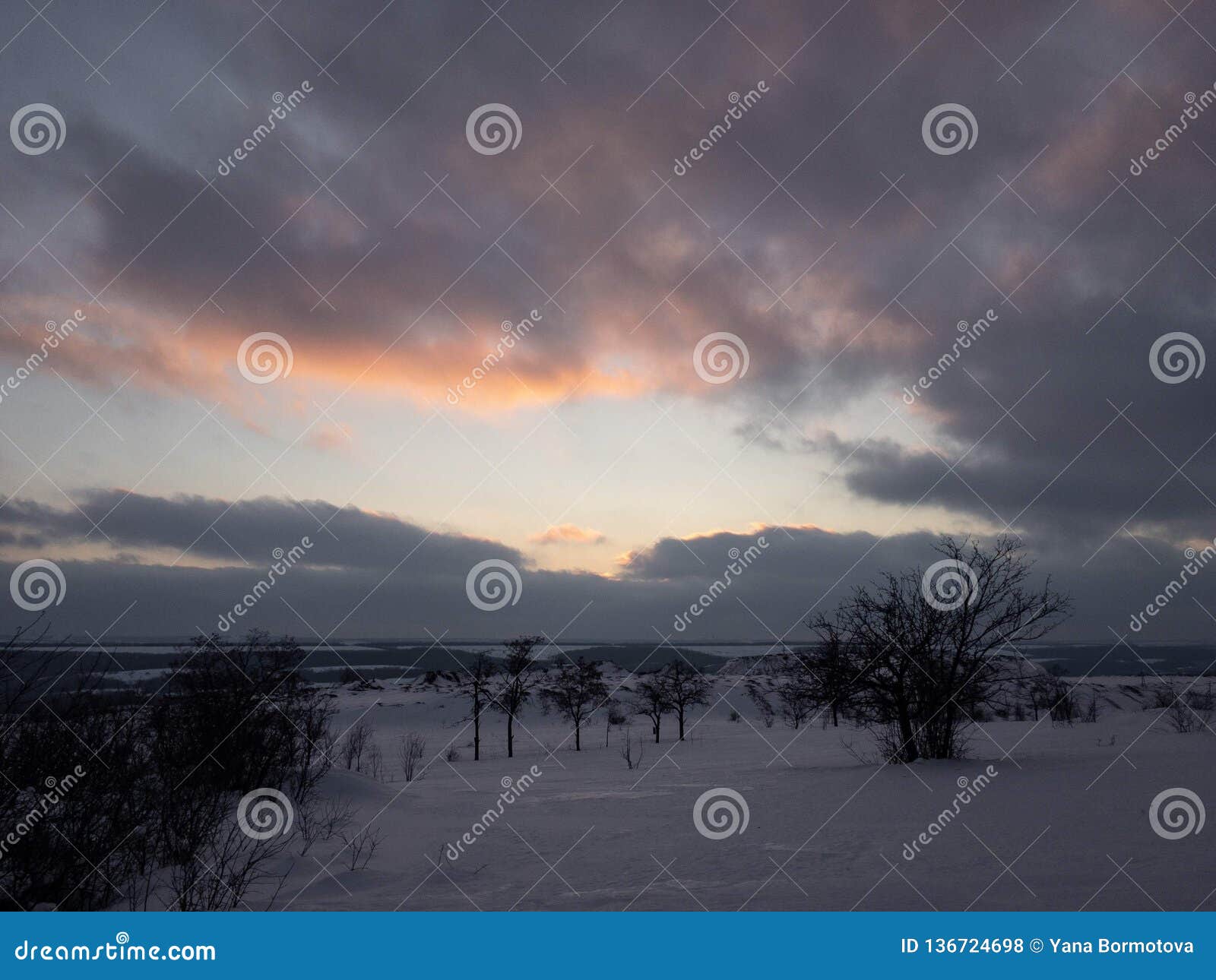 Cloudy sunset in winter stock photo. Image of evening - 136724698
