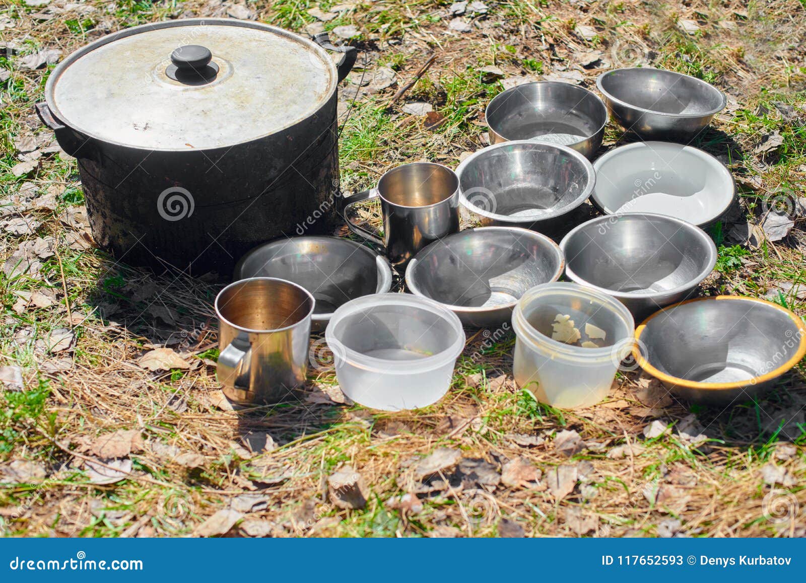 Cauldron and Plates for Soup Stock Image - Image of metallic, camp ...