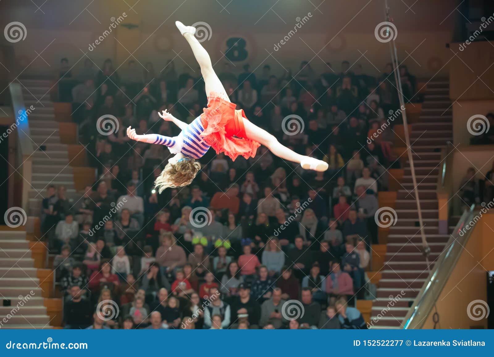 A Clown Acrobat Performs with a Number in Front of the Public ...