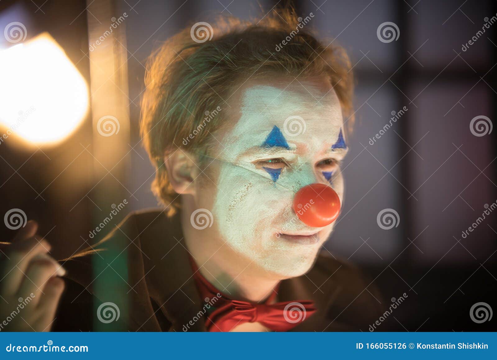 Clown Concept - a Man with Painted Face Looking in the Mirror Stock ...