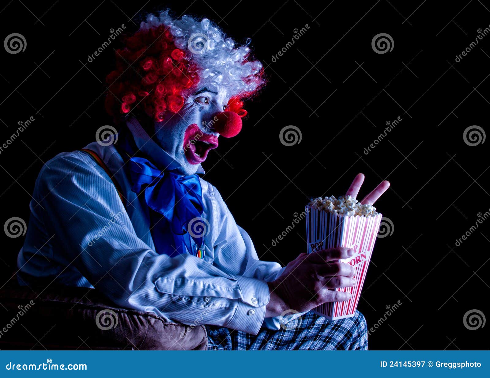 Clown eating popcorn stock image. Image of snack, television - 24145397