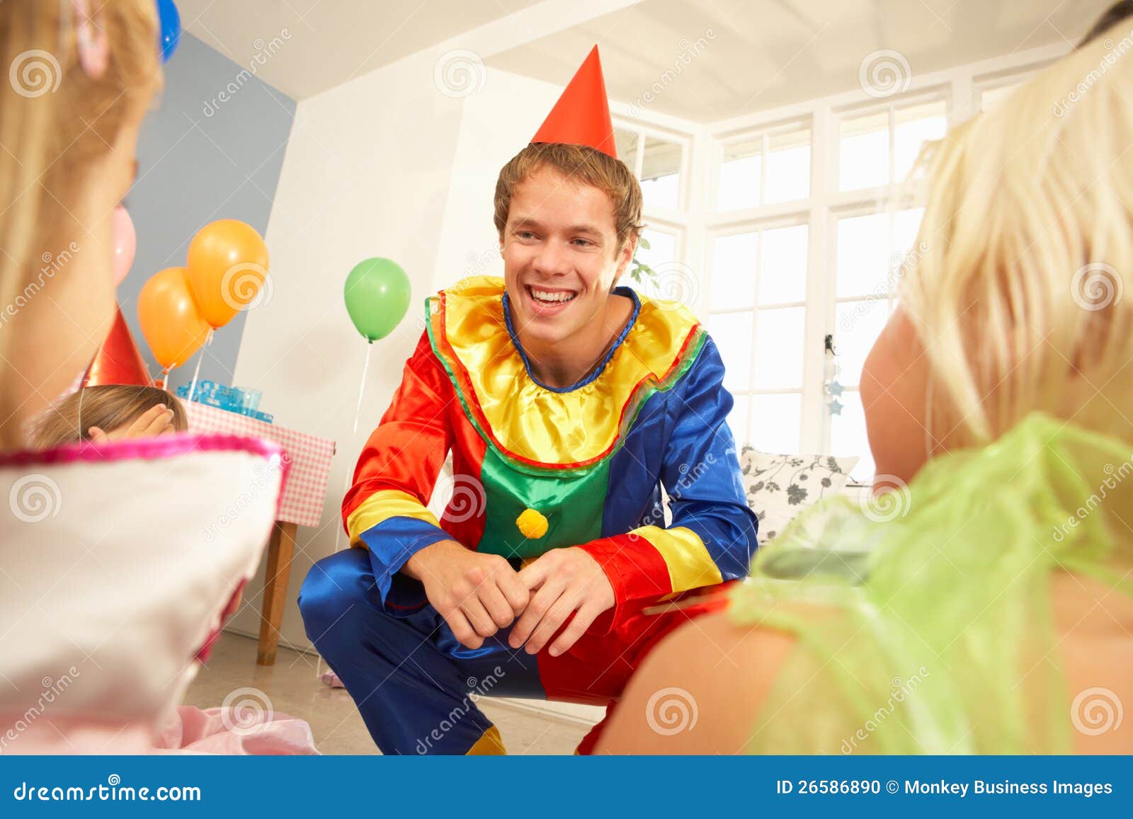 Clown Entertaining Children at Party Stock Photo - Image of ...