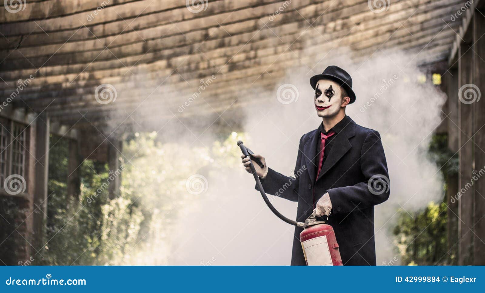 Clown with Fire Extinguisher Stock Photo - Image of fear, spraying ...