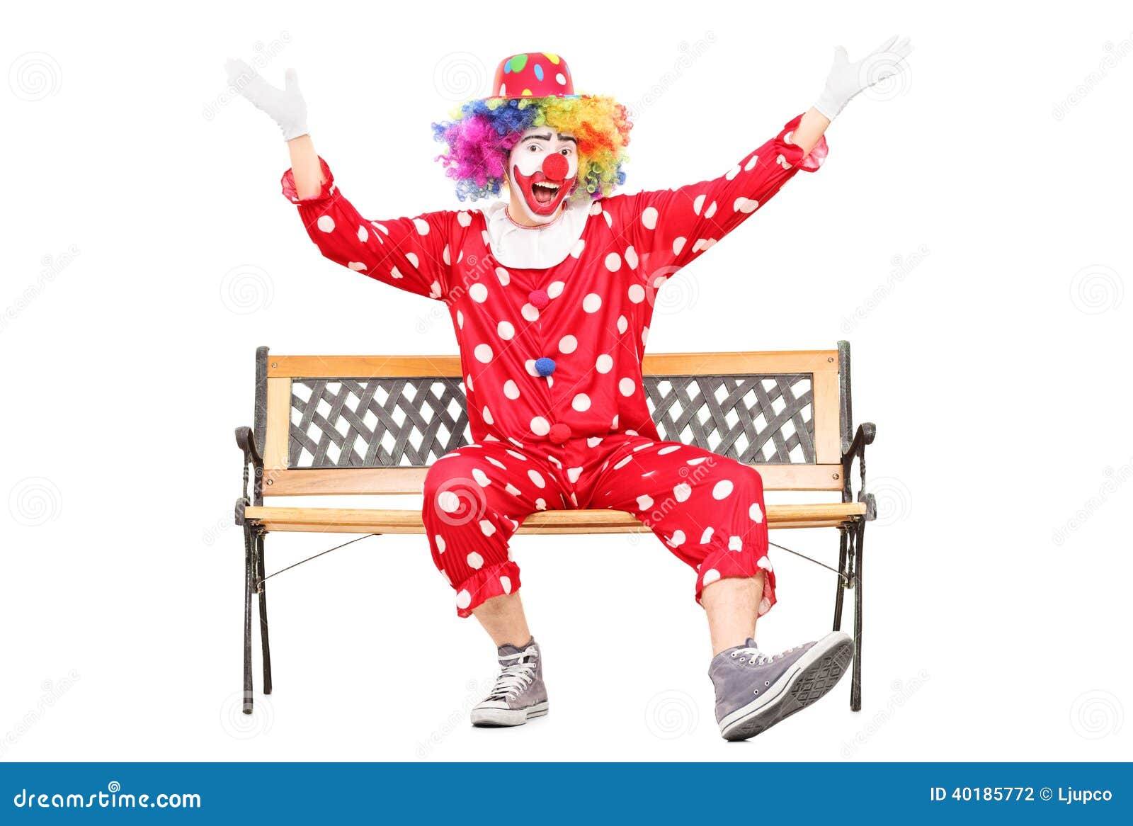 Clown Gesturing Happiness Seated on Bench Stock Photo - Image of ...