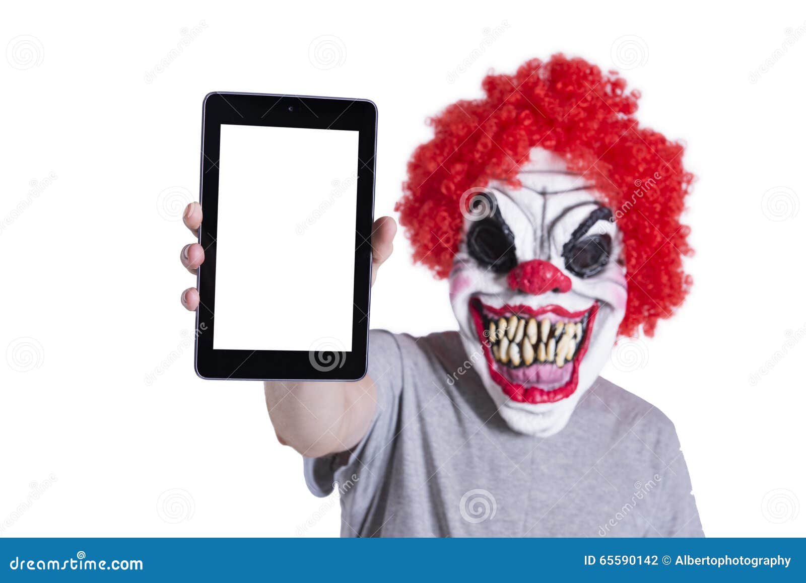 Clown holding a PC tablet stock photo. Image of gorilla - 65590142