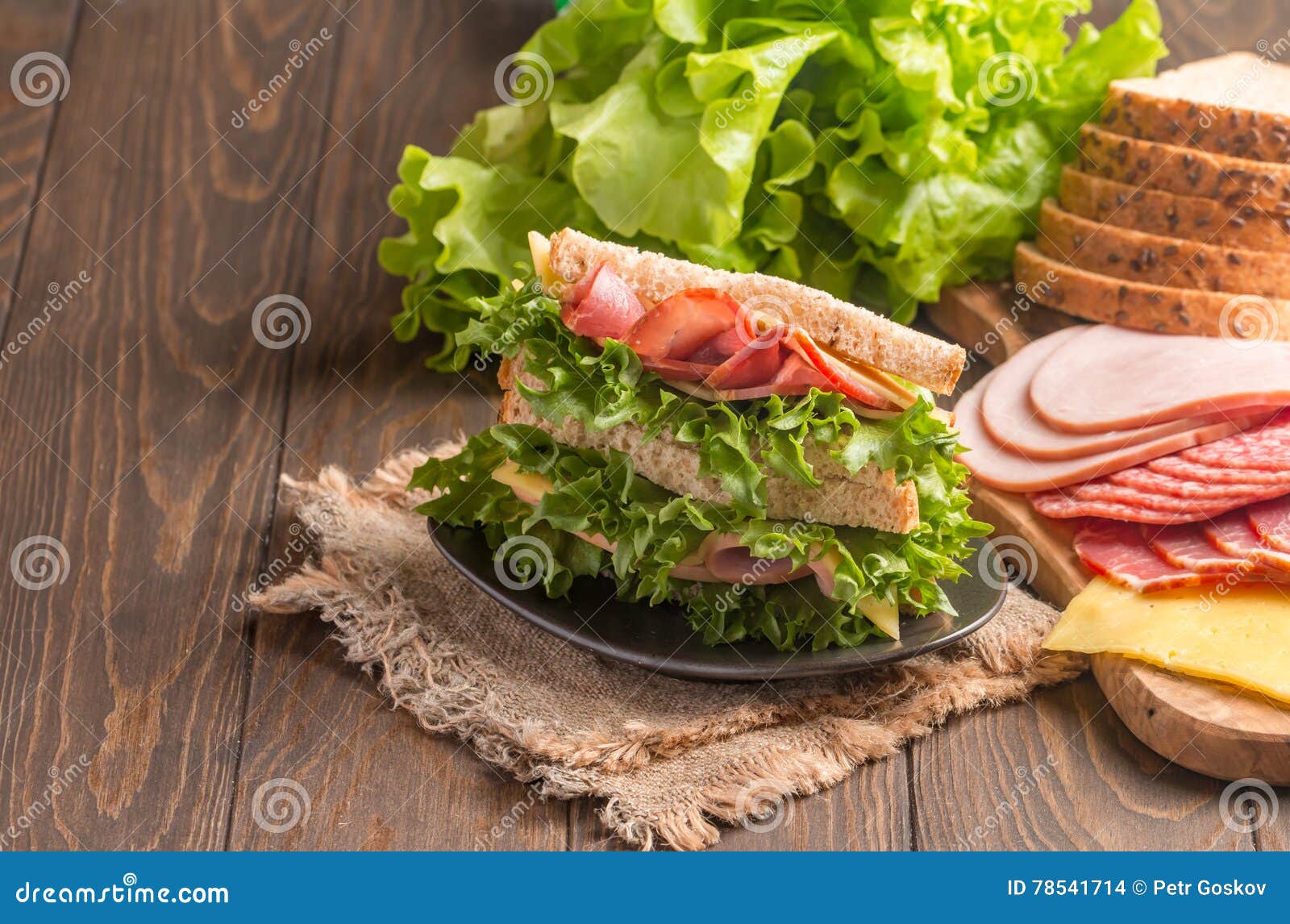 Club Sandwich on a Rustic Table Stock Photo - Image of cheese, tomato ...