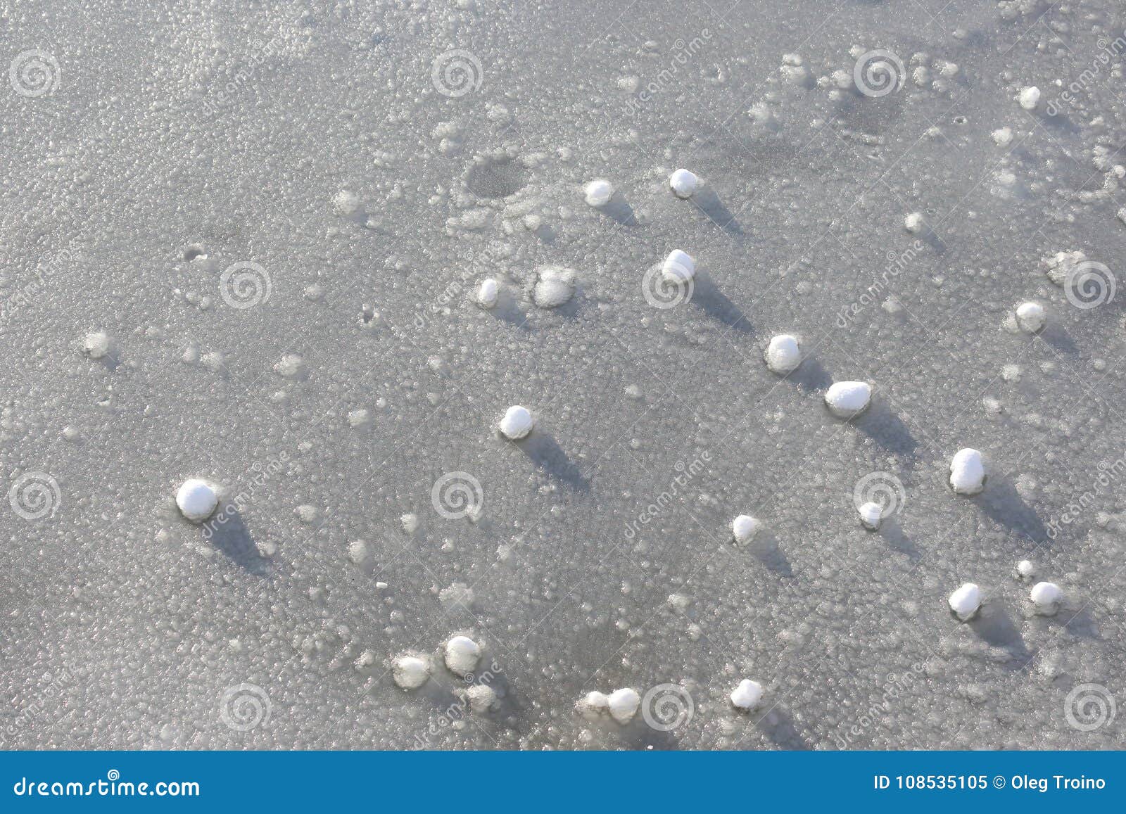 Clumps of snow on the ice stock image. Image of pattern - 108535105