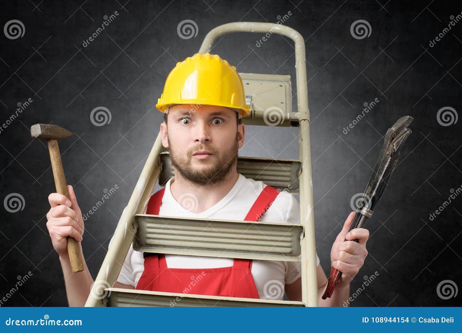 Clumsy worker with tools stock photo. Image of renovation - 108944154