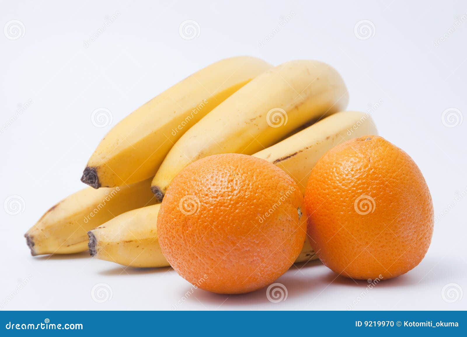 Cluster of Ripe Bananas and Two Oranges Stock Photo - Image of ripe ...
