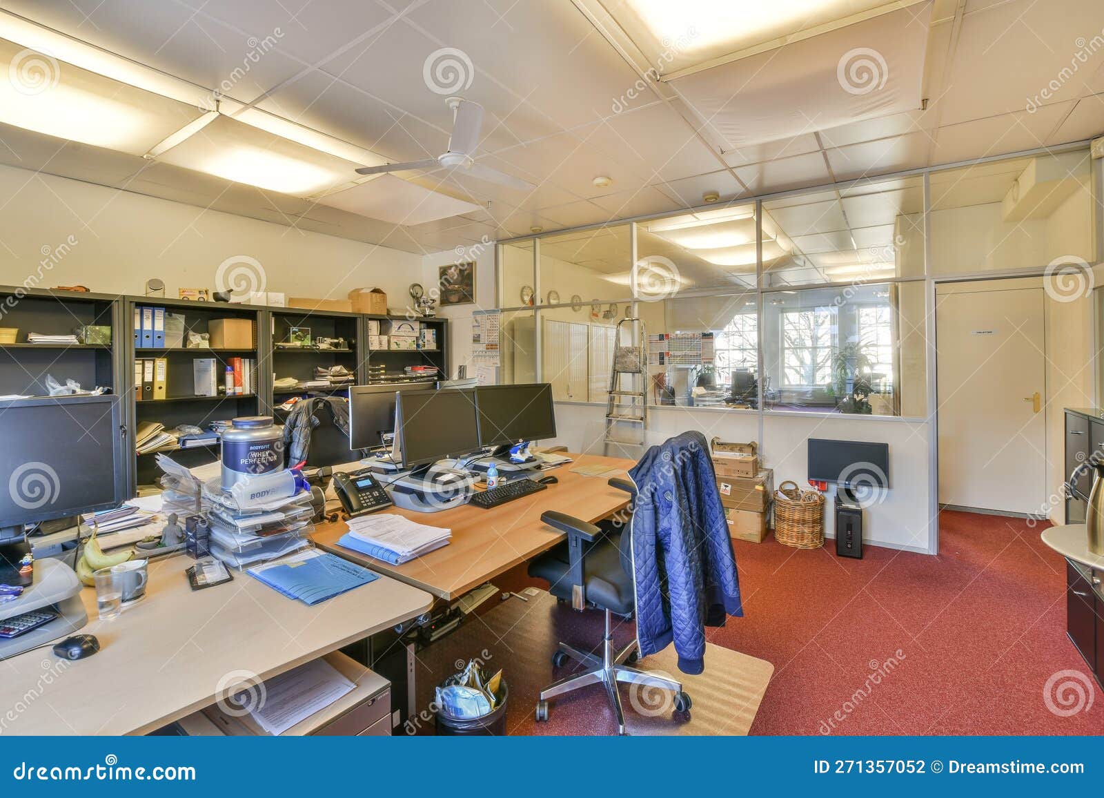 A Cluttered Office with a Desk and a Window Editorial Photography ...