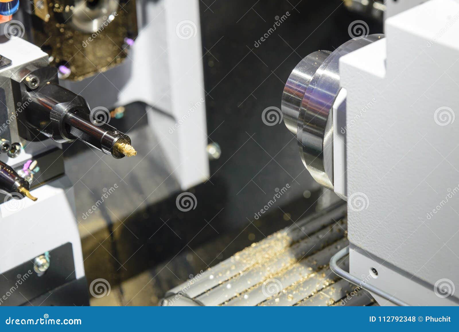 The CNC Lathe Machine Cutting the Brass Stock Photo - Image of ...