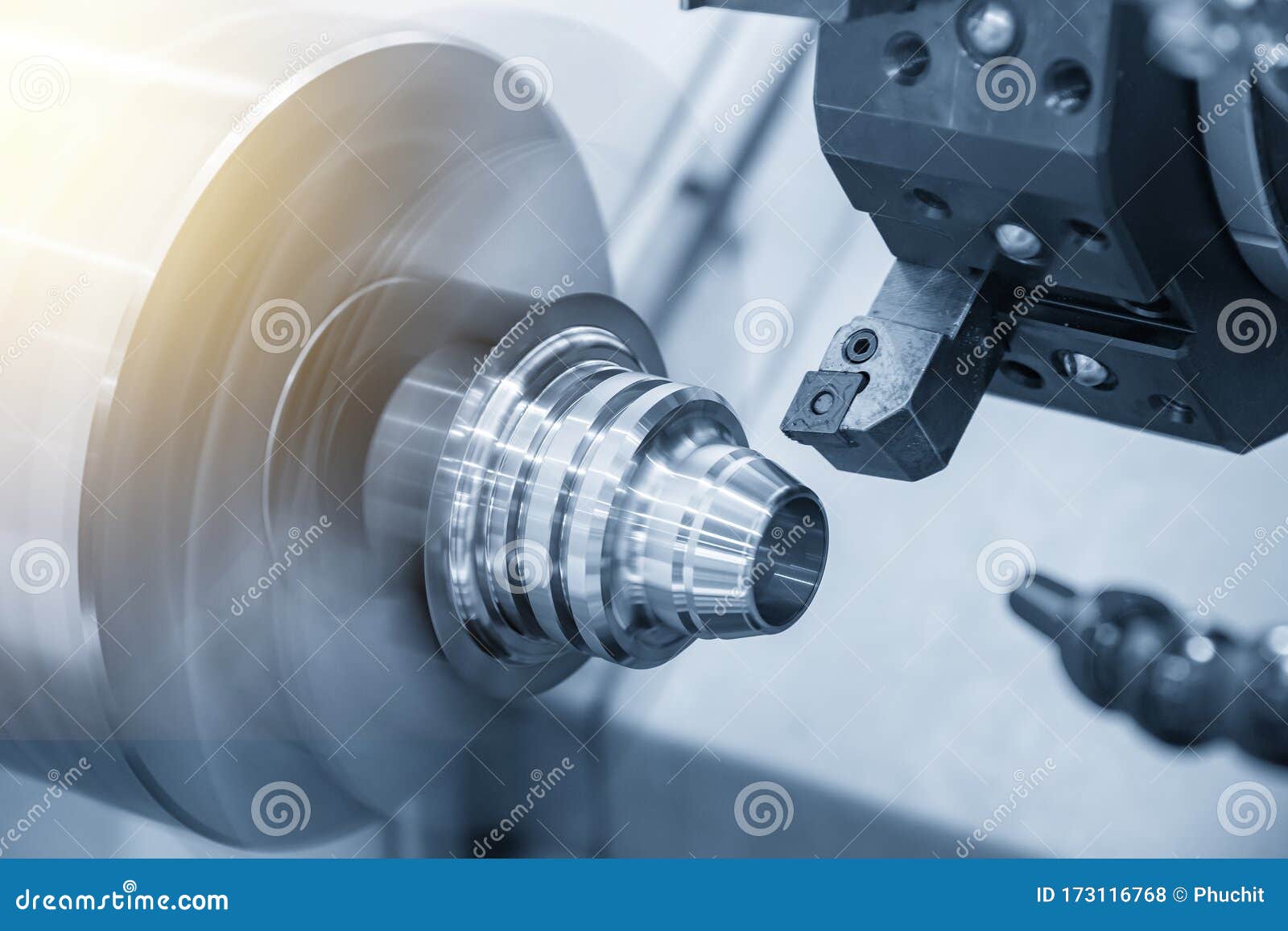 The CNC Lathe Machine in Metal Working Process Finish Cutting the Metal ...