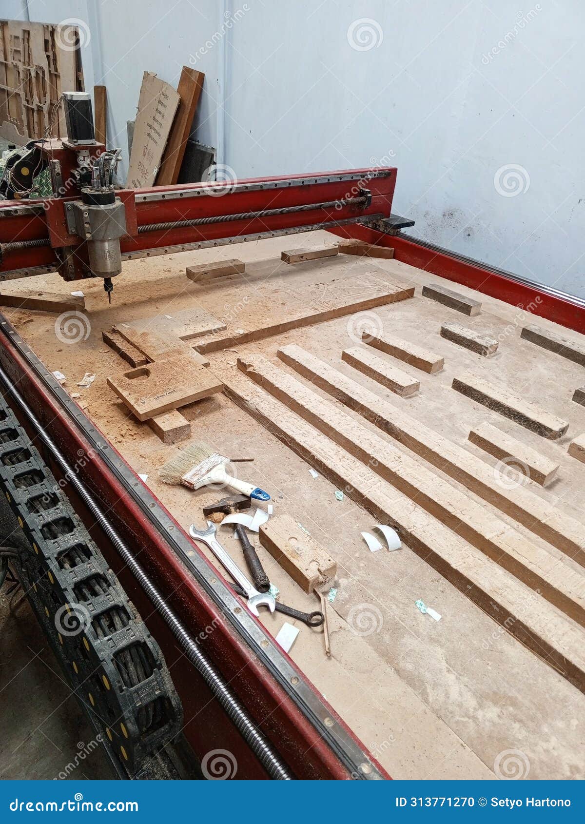 CNC Machine with a Multiplex Base and Wooden Bars As a Supporting ...