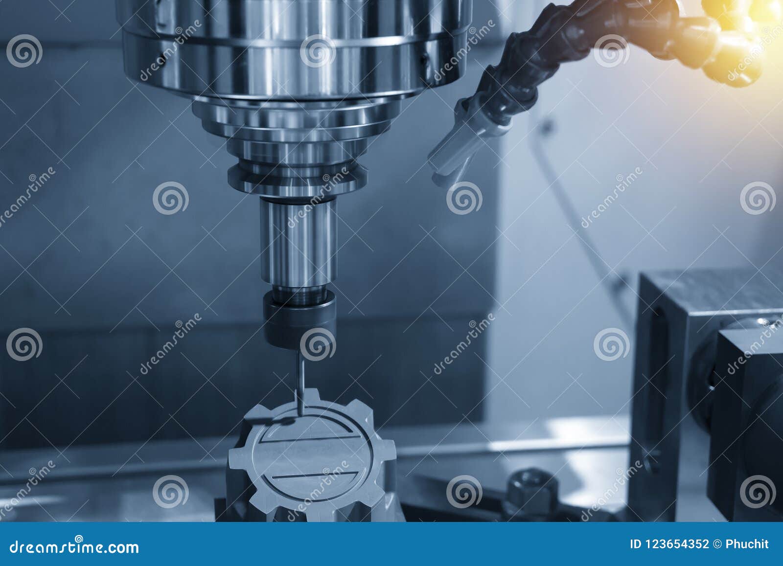 The CNC Milling Machine Cutting the Graphite Electrode Part Stock Photo ...