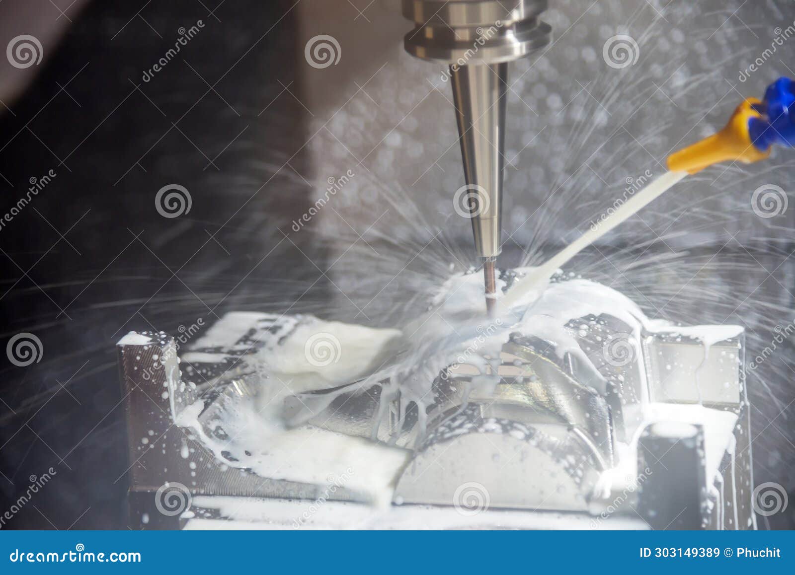 The CNC Milling Machine Cutting the Mold Part with Liquid Coolant ...