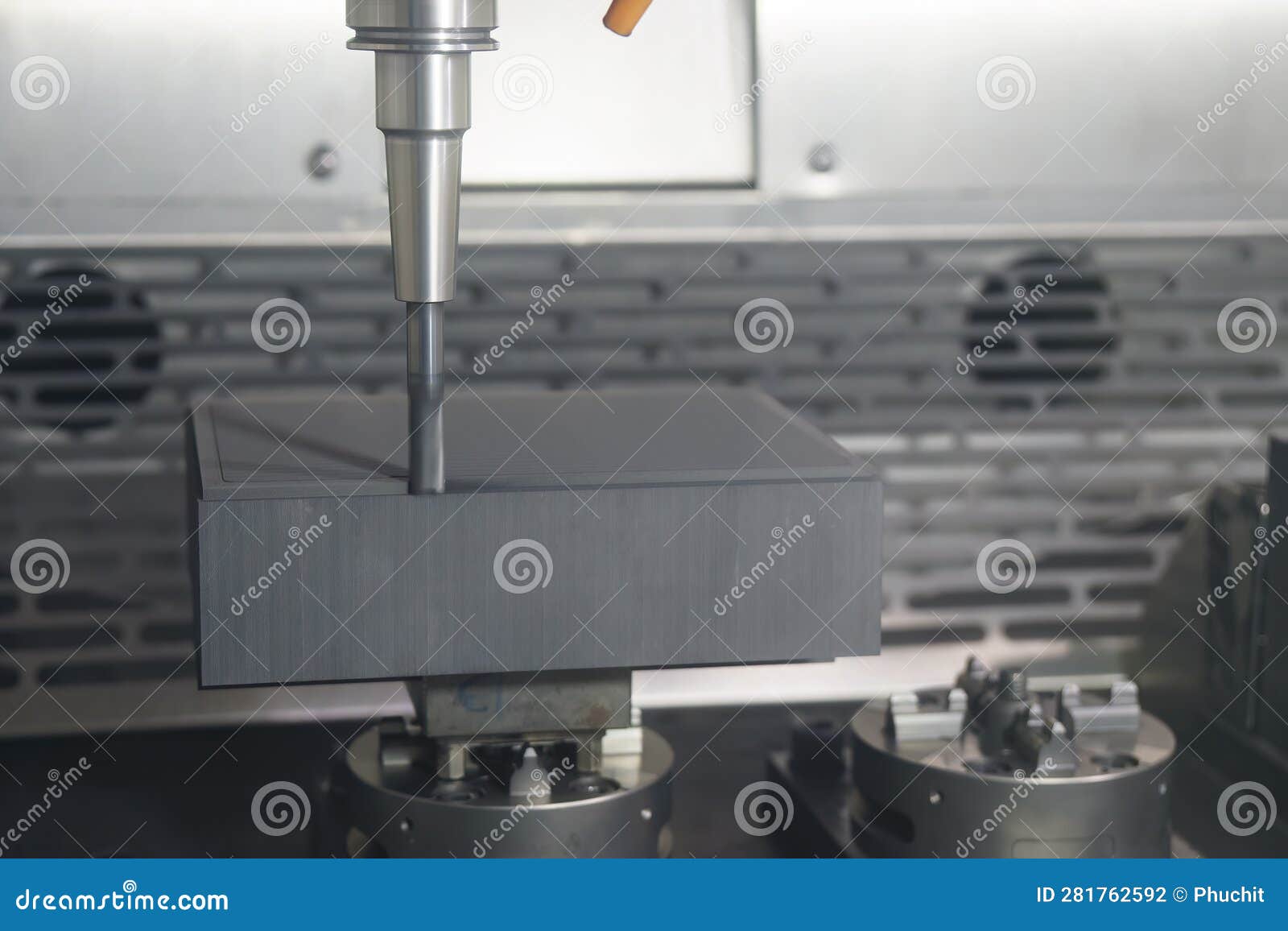 The CNC Milling Machine Rough Cutting the Graphite Electrode Parts with ...