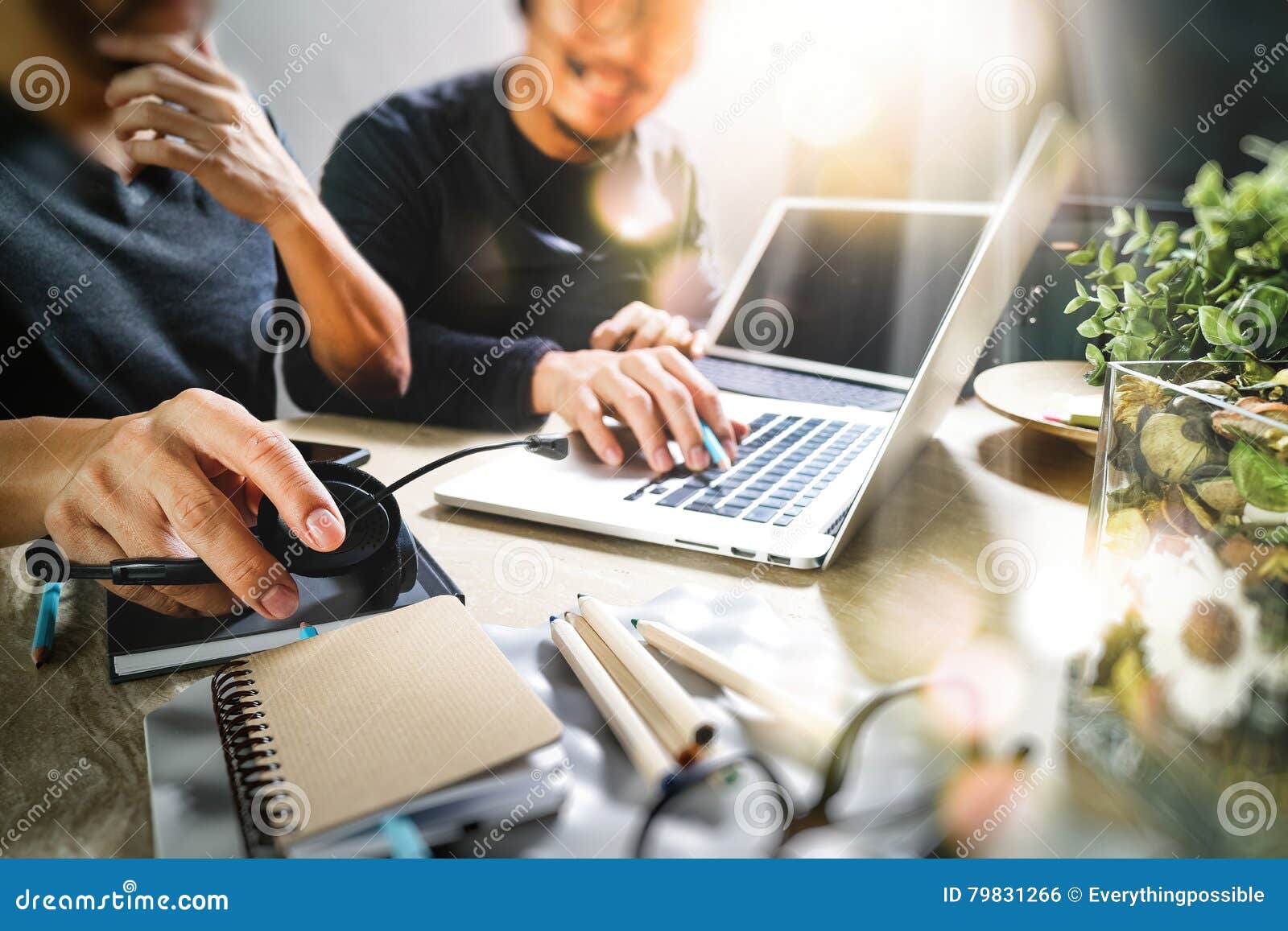 Co Worker Using VOIP Headset with Digital Tablet Computer Docking Smart ...