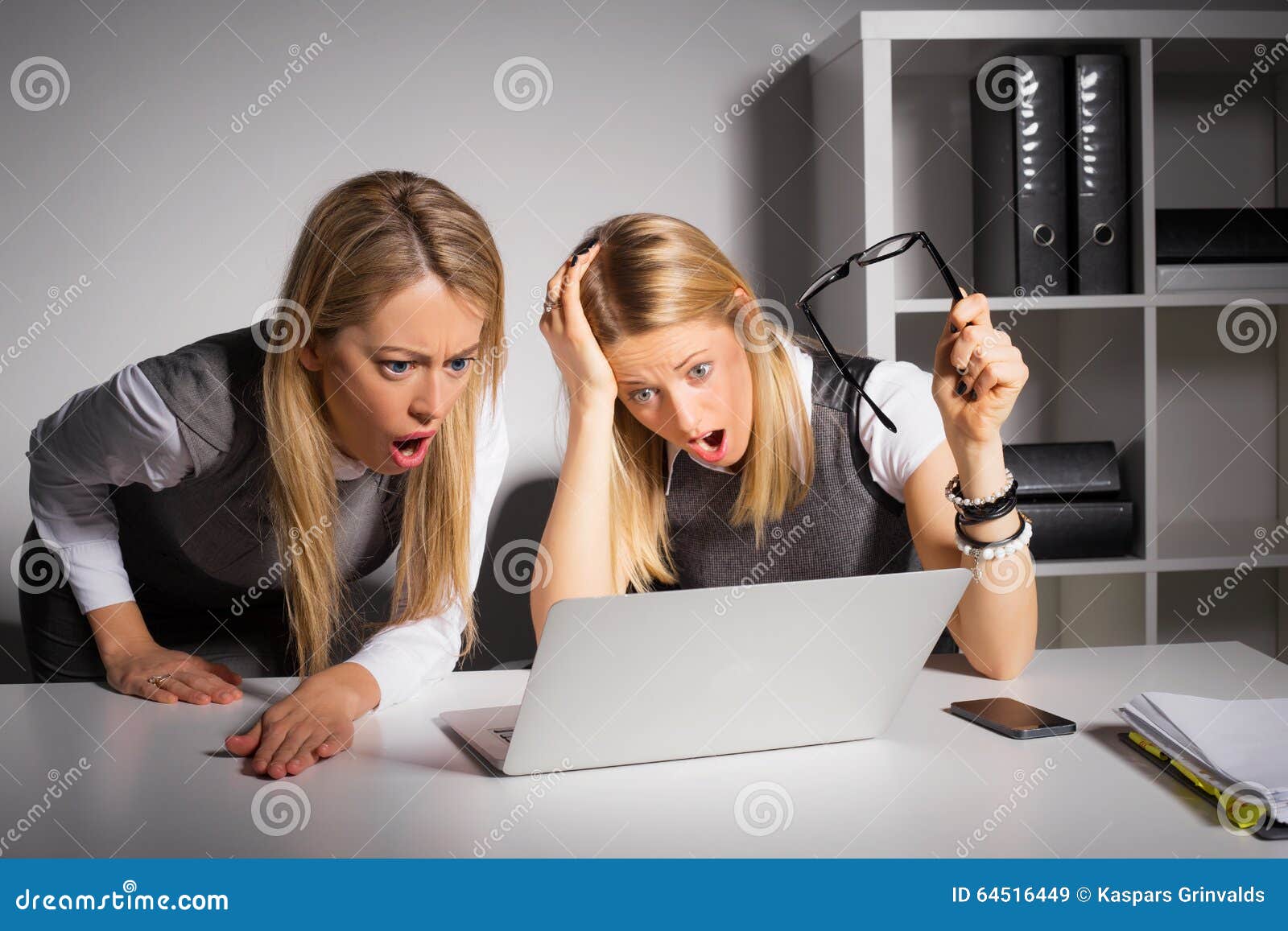 Co-workers Looking at Computer in Shock Stock Image - Image of hands ...