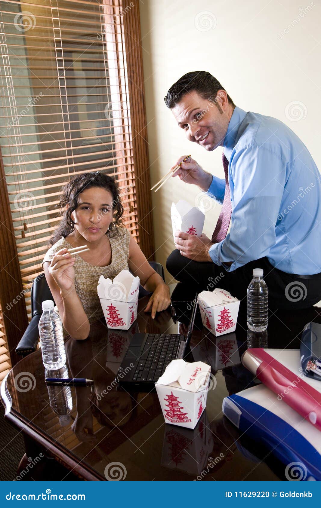 Co-workers in Office Eating Chinese Takeout Food Stock Photo - Image of ...