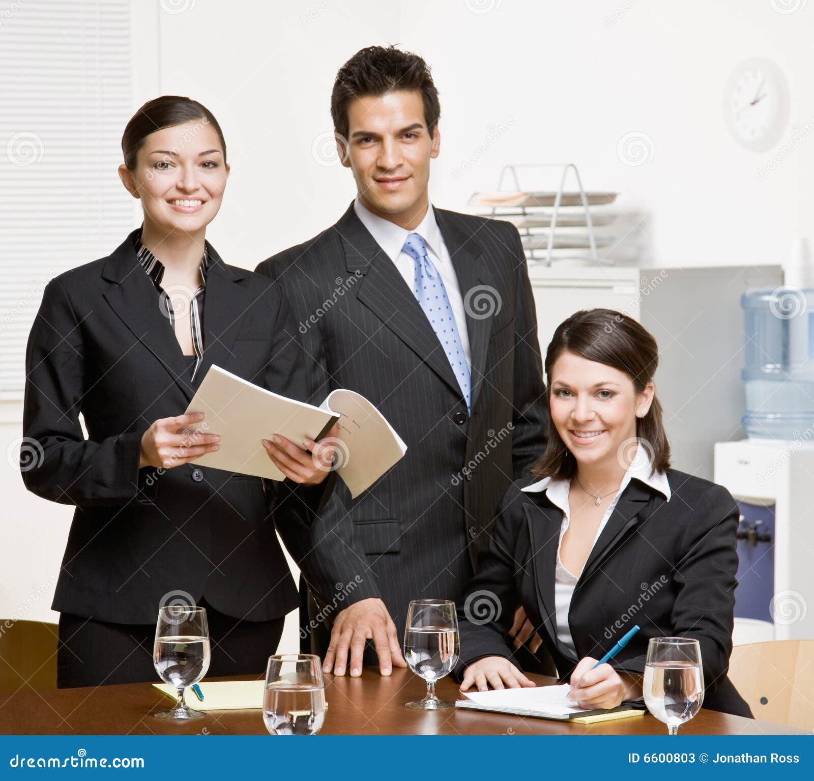 Co-workers with Paperwork in Conference Room Stock Image - Image of ...