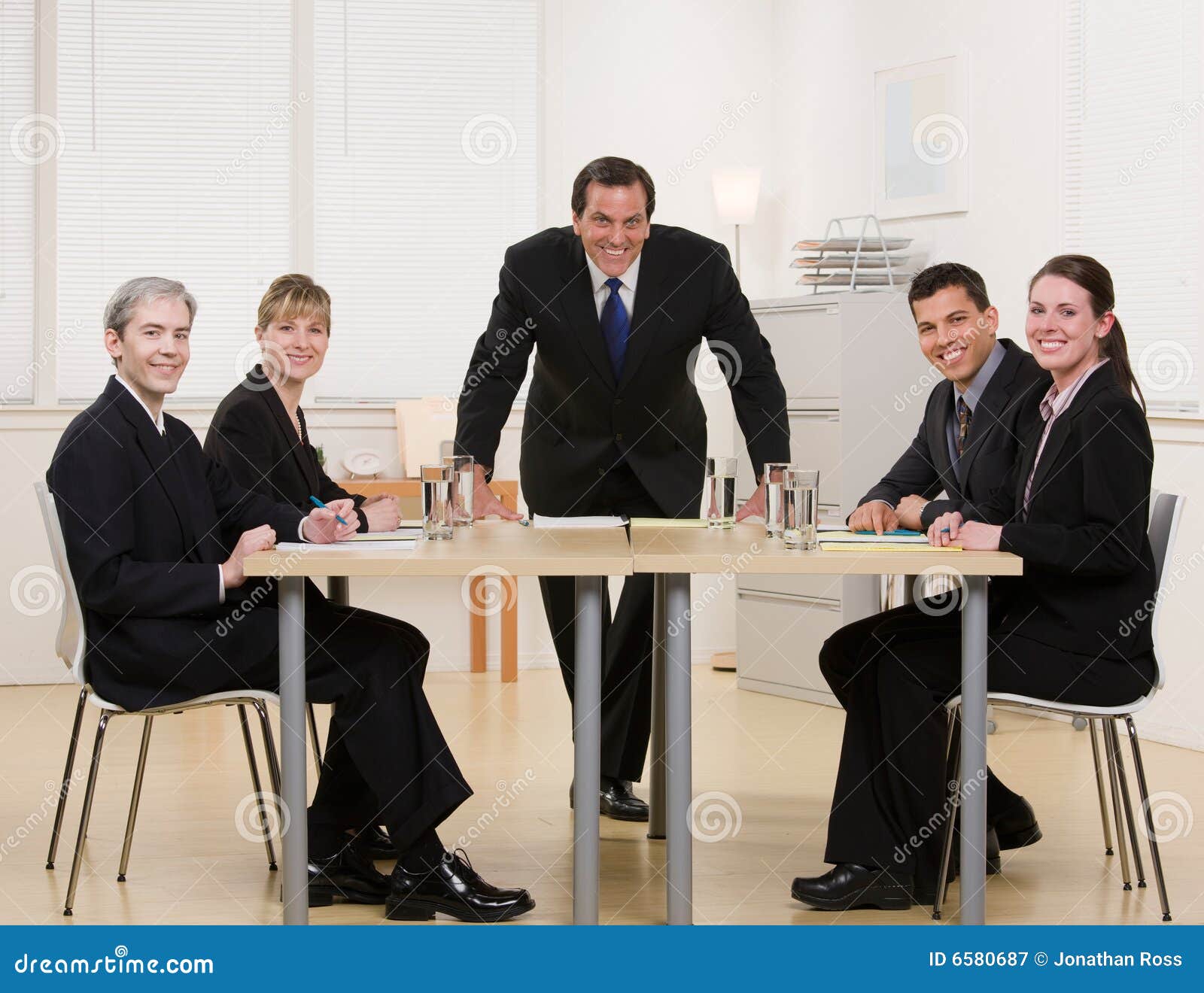 Co-workers Sitting at Conference Table Stock Image - Image of authority ...