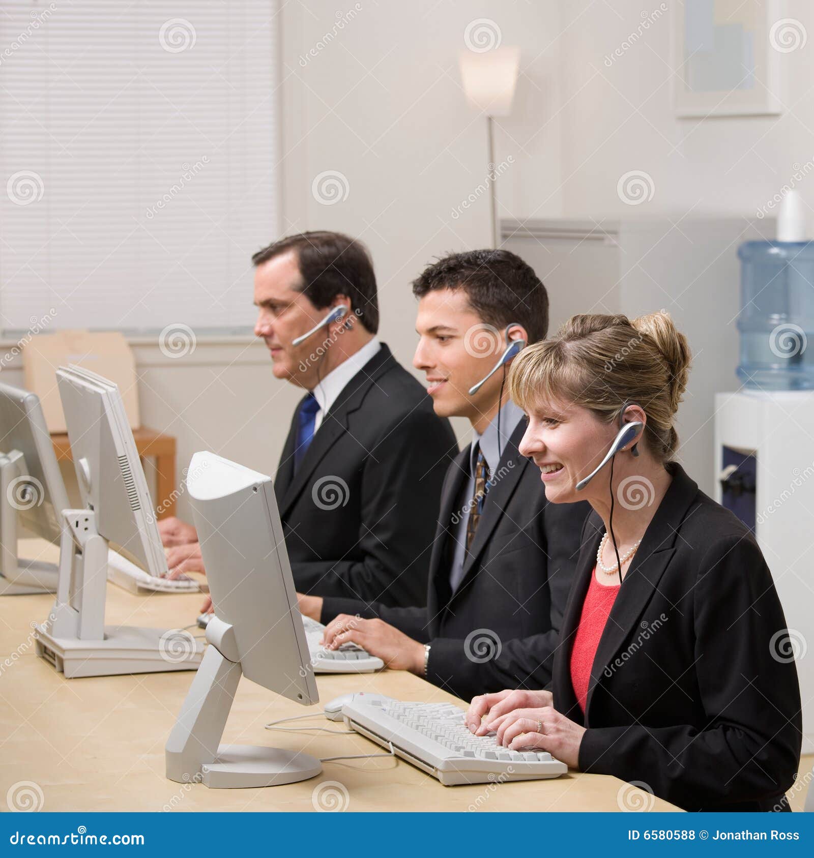 Co-workers Working at Computers in Call Center Stock Photo - Image of ...