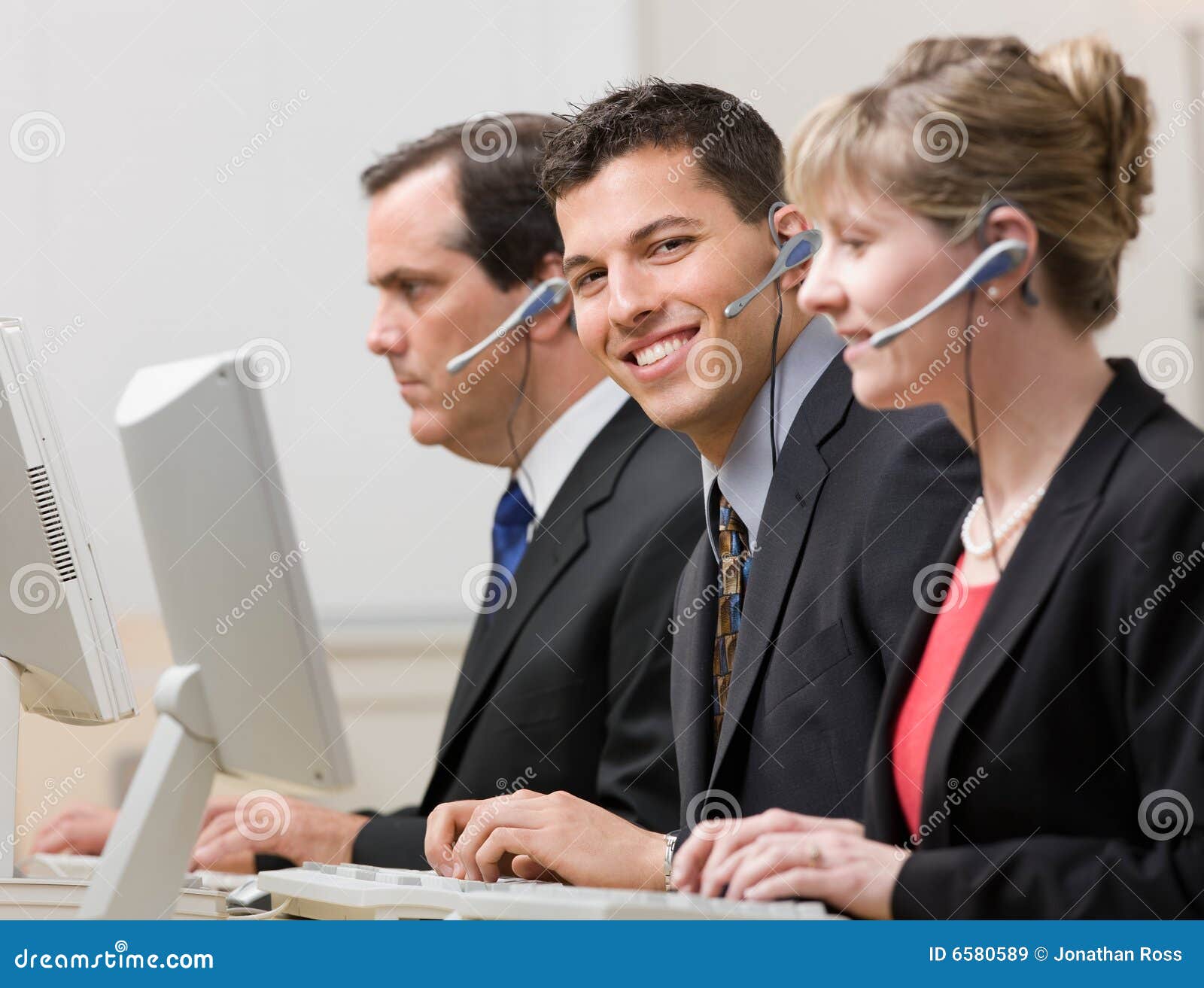 Co-workers Working at Computers in Call Center Stock Image - Image of ...