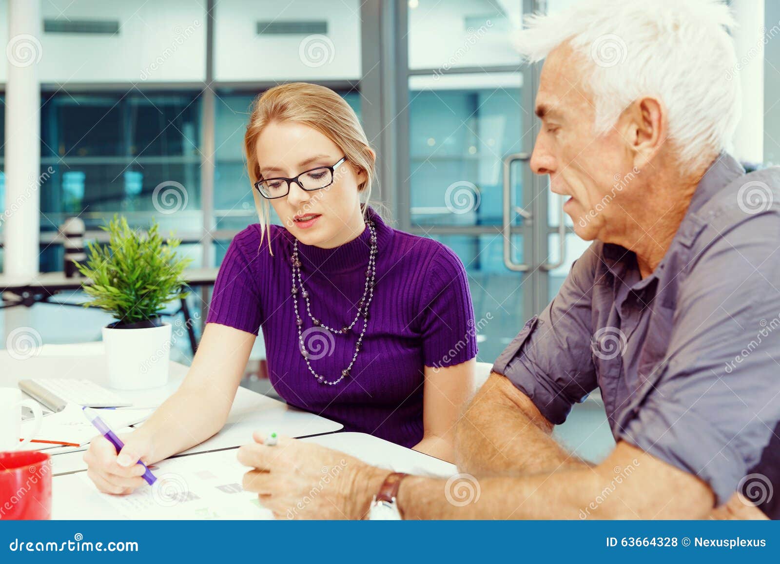Co-workers Working Together Stock Photo - Image of business, indoors ...