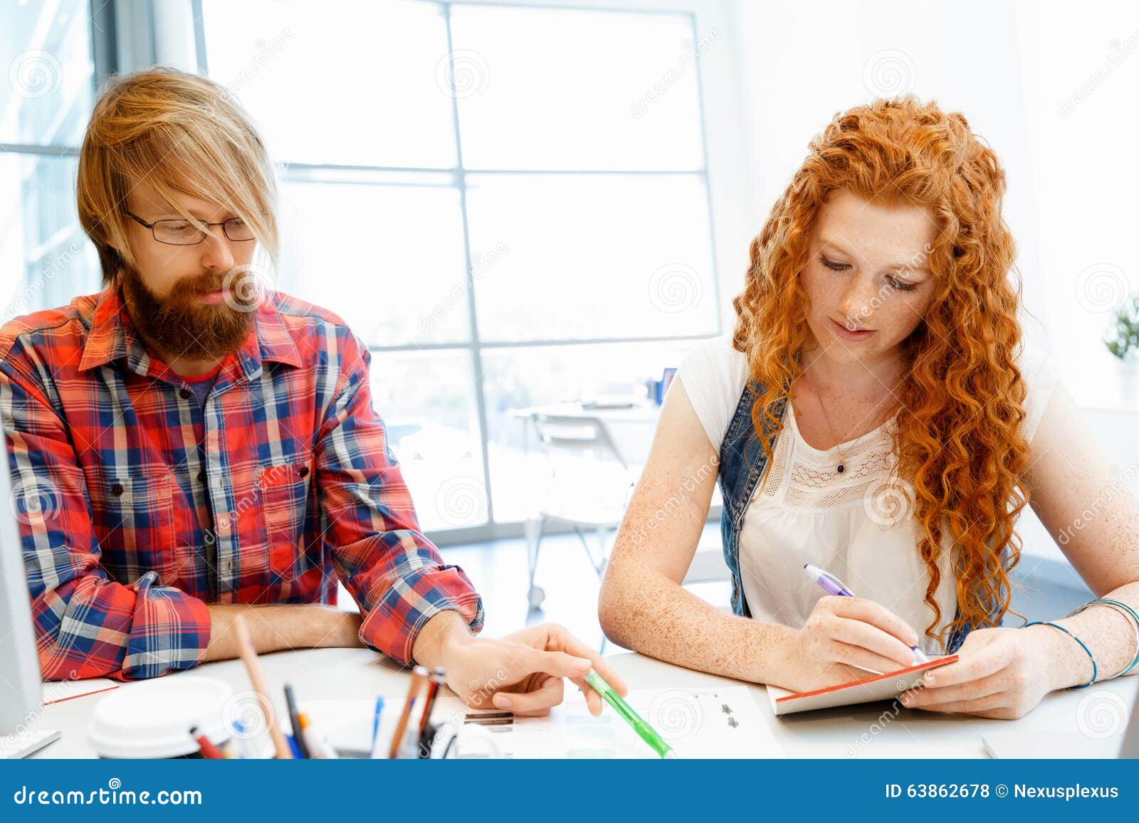 Co-workers Working Together Stock Photo - Image of indoors, budget ...