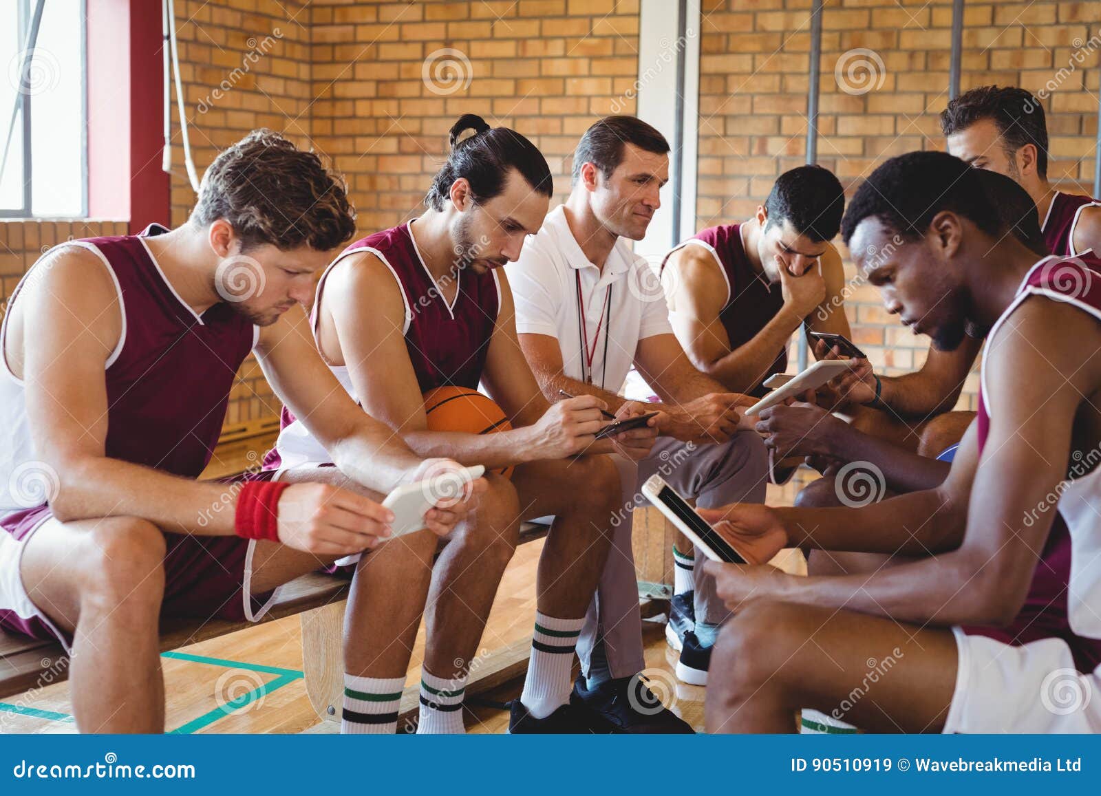 Coach and Basketball Players Using Digital Tablet Stock Image - Image ...