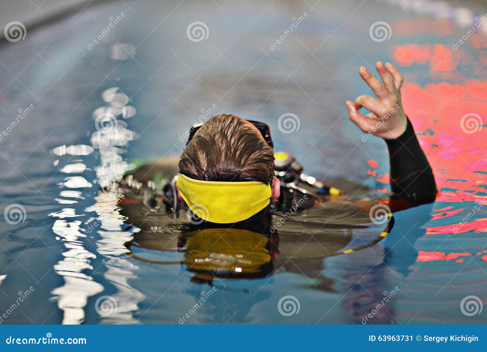 Coach diving in water stock image. Image of instructor - 63963731