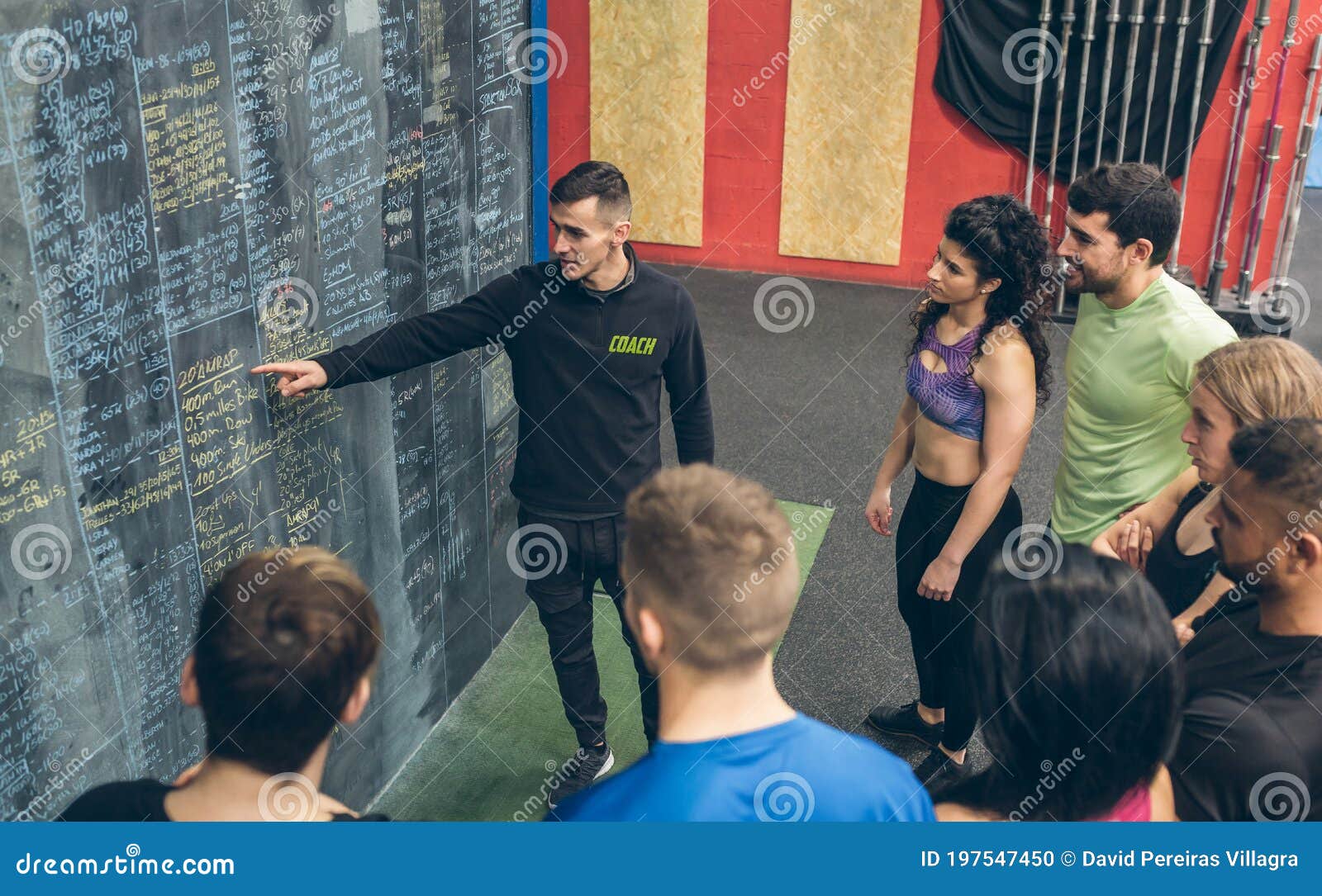 Coach Explaining To Athletes in the Gym Stock Photo - Image of overhead ...