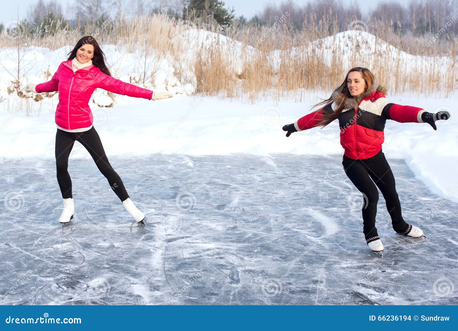 Coach of Figure Skating with Apprentice Practise at the Frozen Lake ...