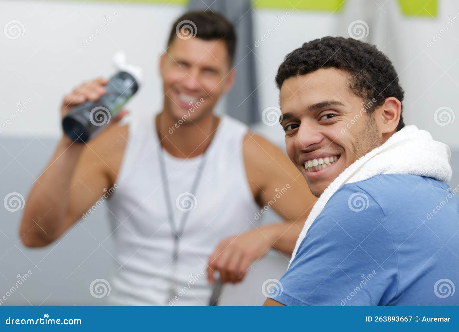 Coach and Player Talking in Changing Room Stock Image - Image of coach ...