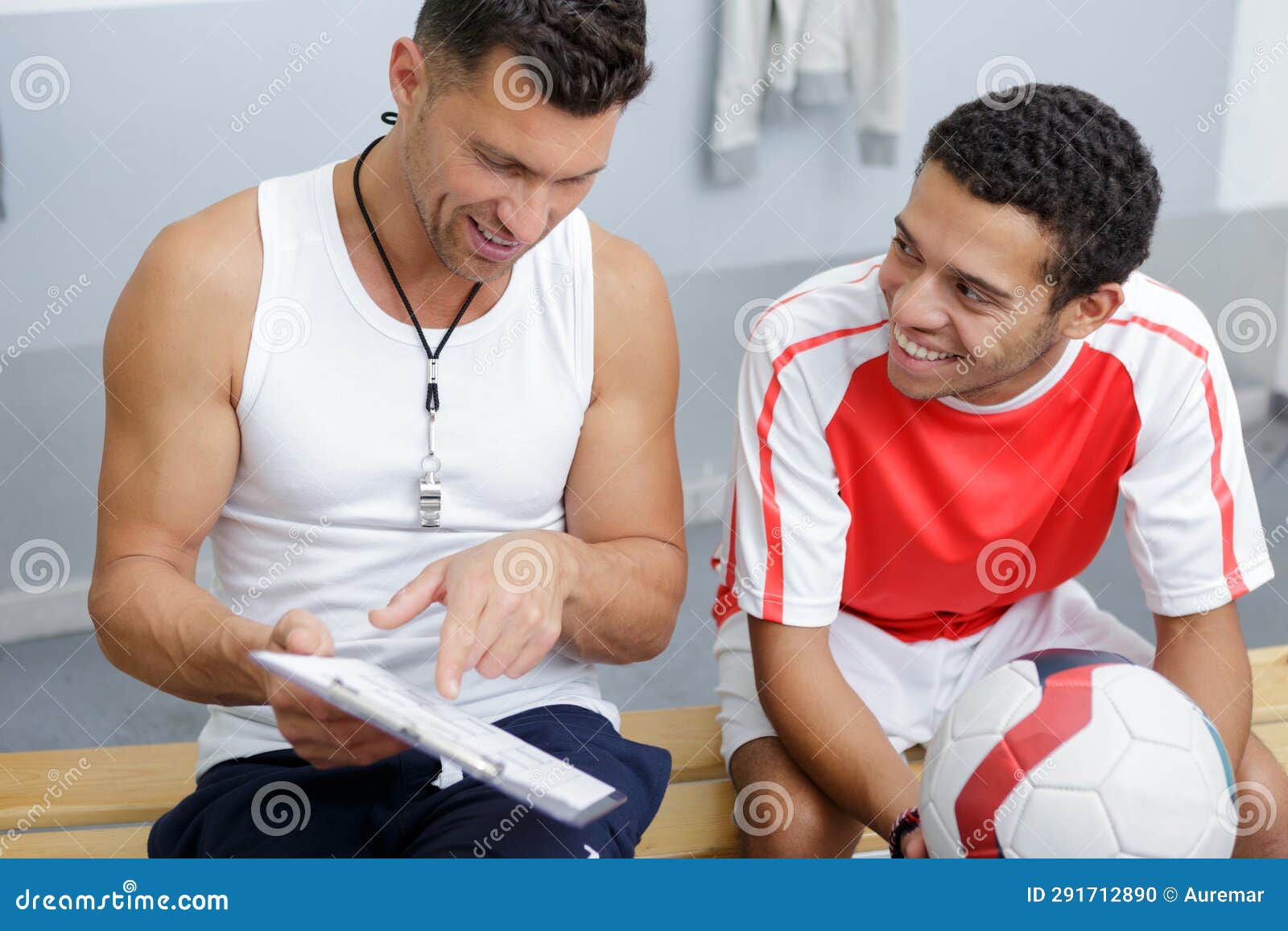 Coach and Player Talking in Changing Room Stock Photo - Image of ...
