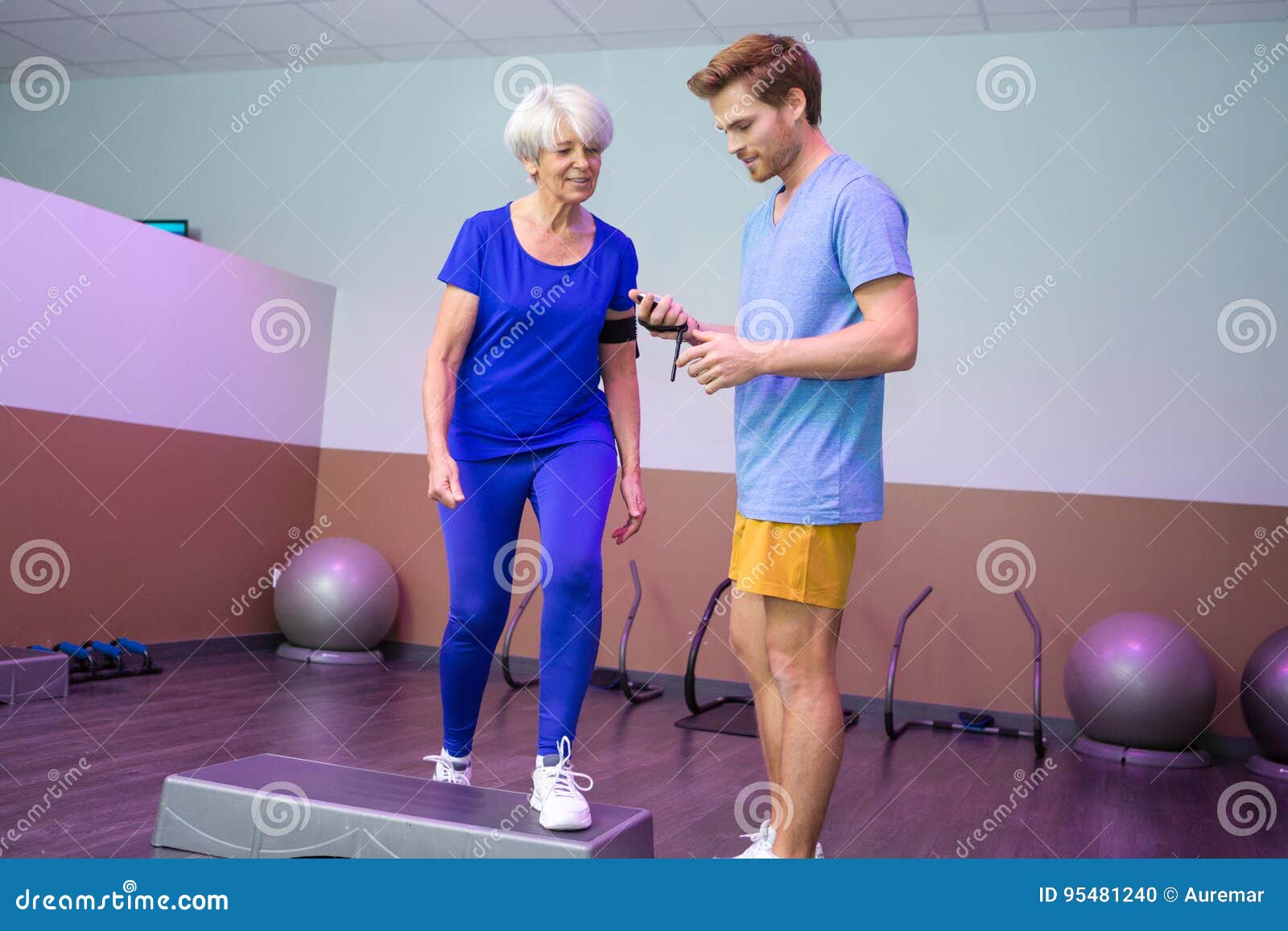 Coach Showing Timer for Elderly Woman Stock Photo - Image of activity ... Coach Showing Timer for Elderly Woman Stock Photo - Image of activity ...