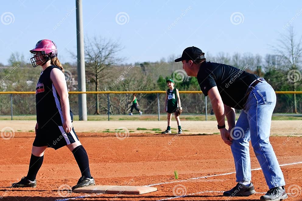 Coaching Girl s Softball editorial stock image. Image of kids - 13739059