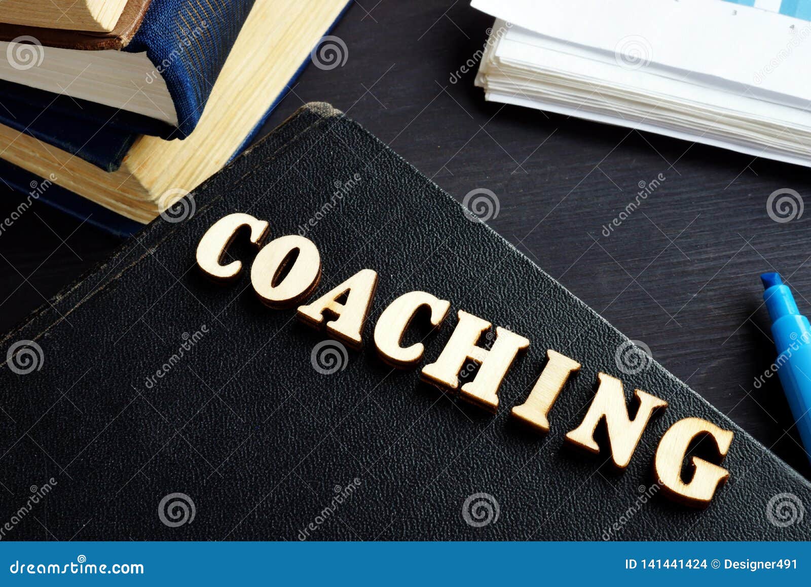 Coaching from Wooden Letters on a Book. Mentoring Stock Photo - Image ...