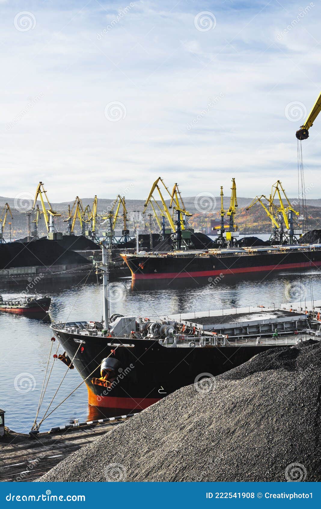 Coal is Loaded into the Holds of a Dry Cargo Ship in the Seaport 24 ...