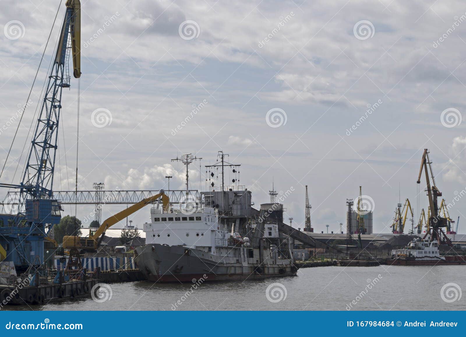 Coal Loading or Unloading of a Grey Bulk Carrier with a White Deck ...