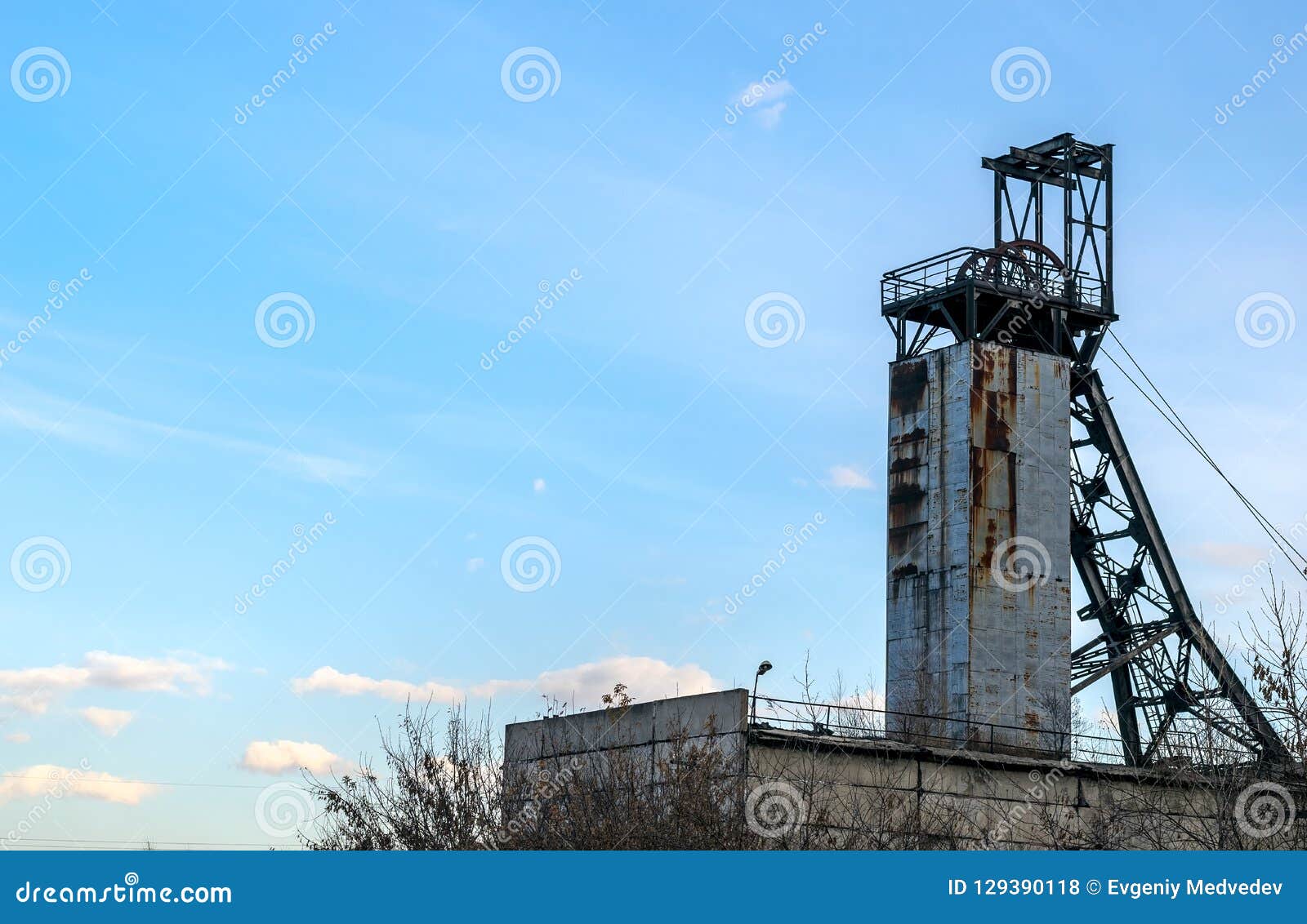 Coal Mine with Wheels. Colliery Against the Blue Sky Stock Photo ...