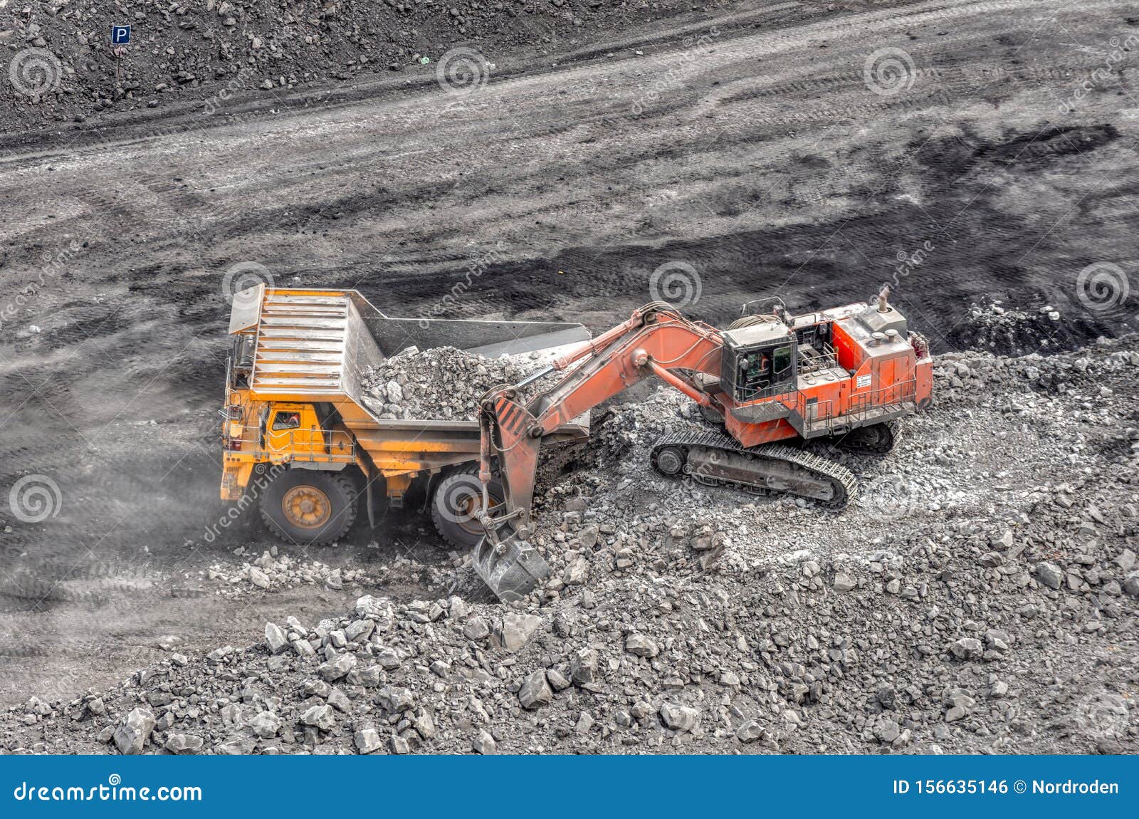 Coal Mining in a Quarry. a Hydraulic Excavator Loads a Dump Truck Stock ...