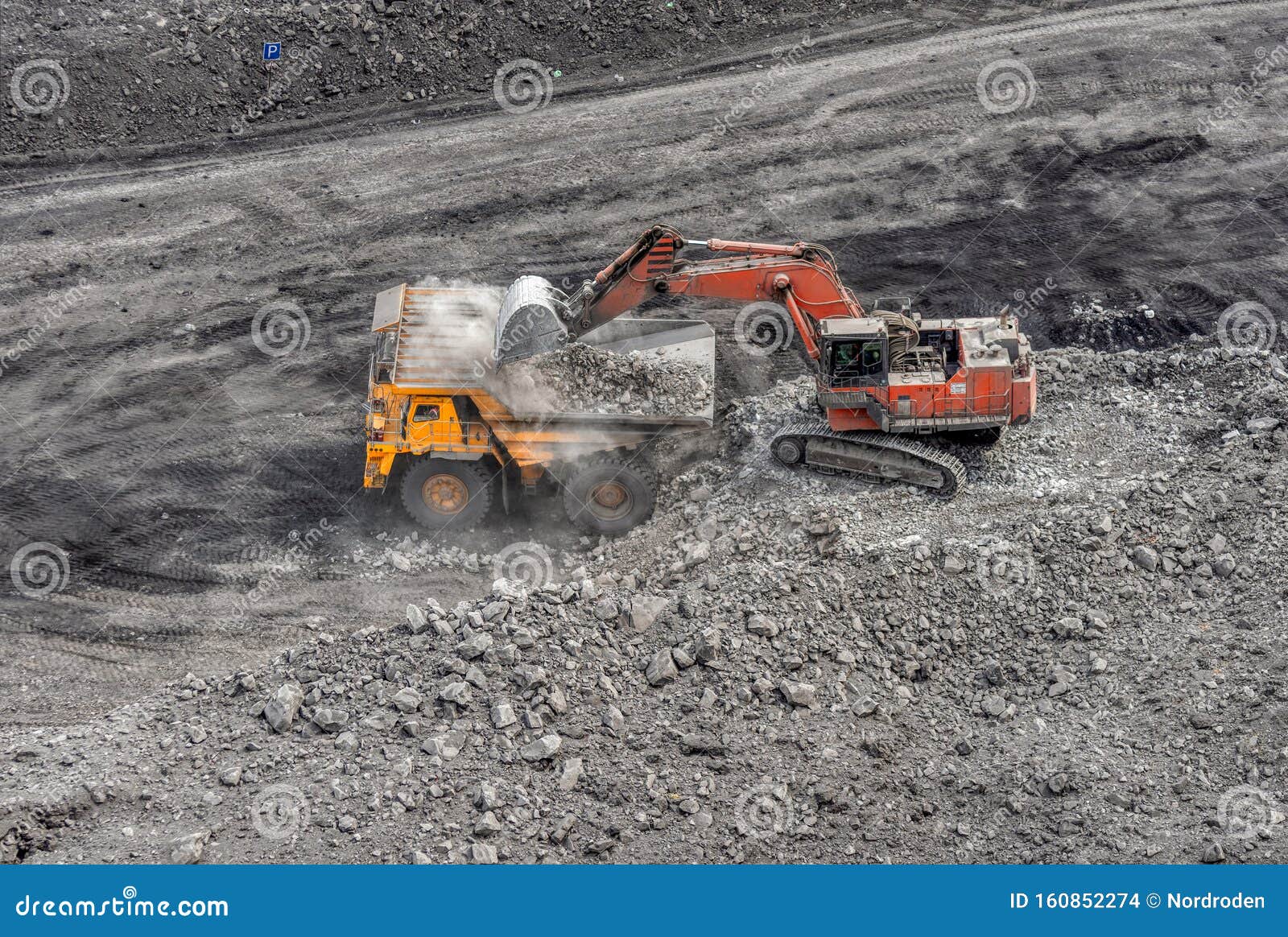 Coal Mining in a Quarry. a Hydraulic Excavator Loads a Dump Truck Stock ...
