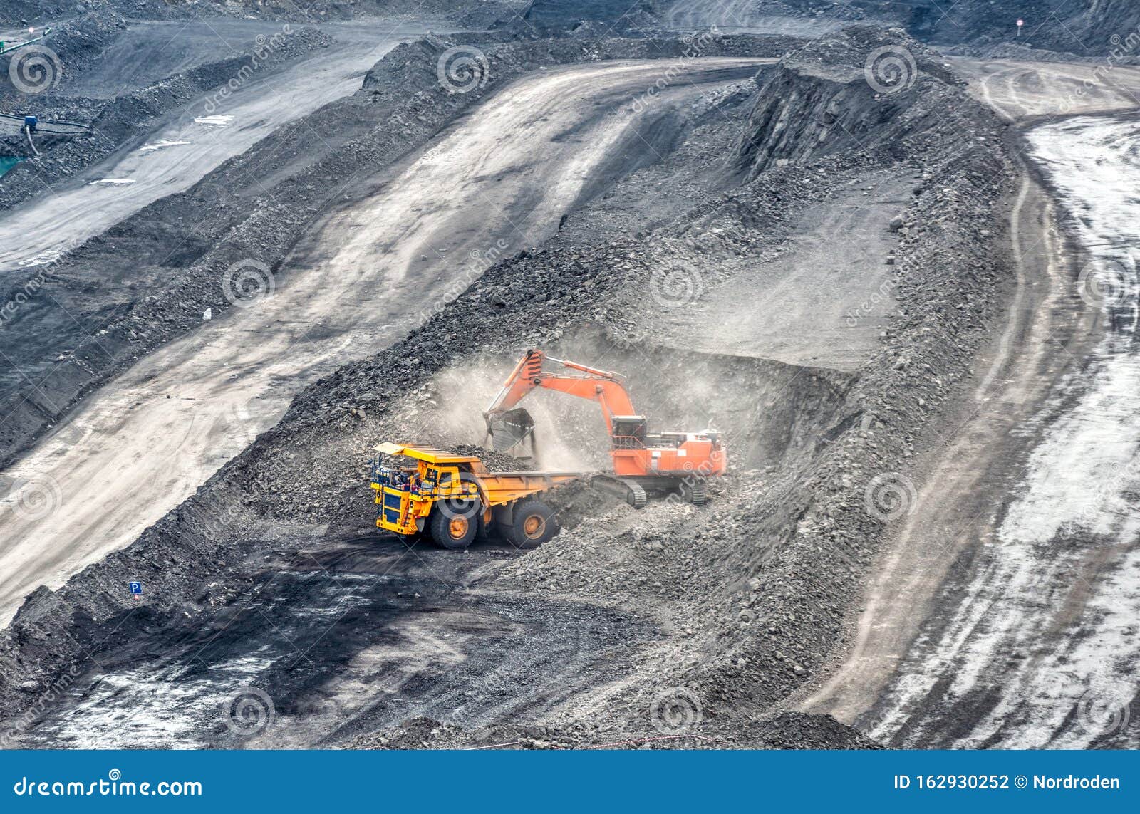 Coal Mining in a Quarry. a Hydraulic Excavator Loads a Dump Truck Stock ...
