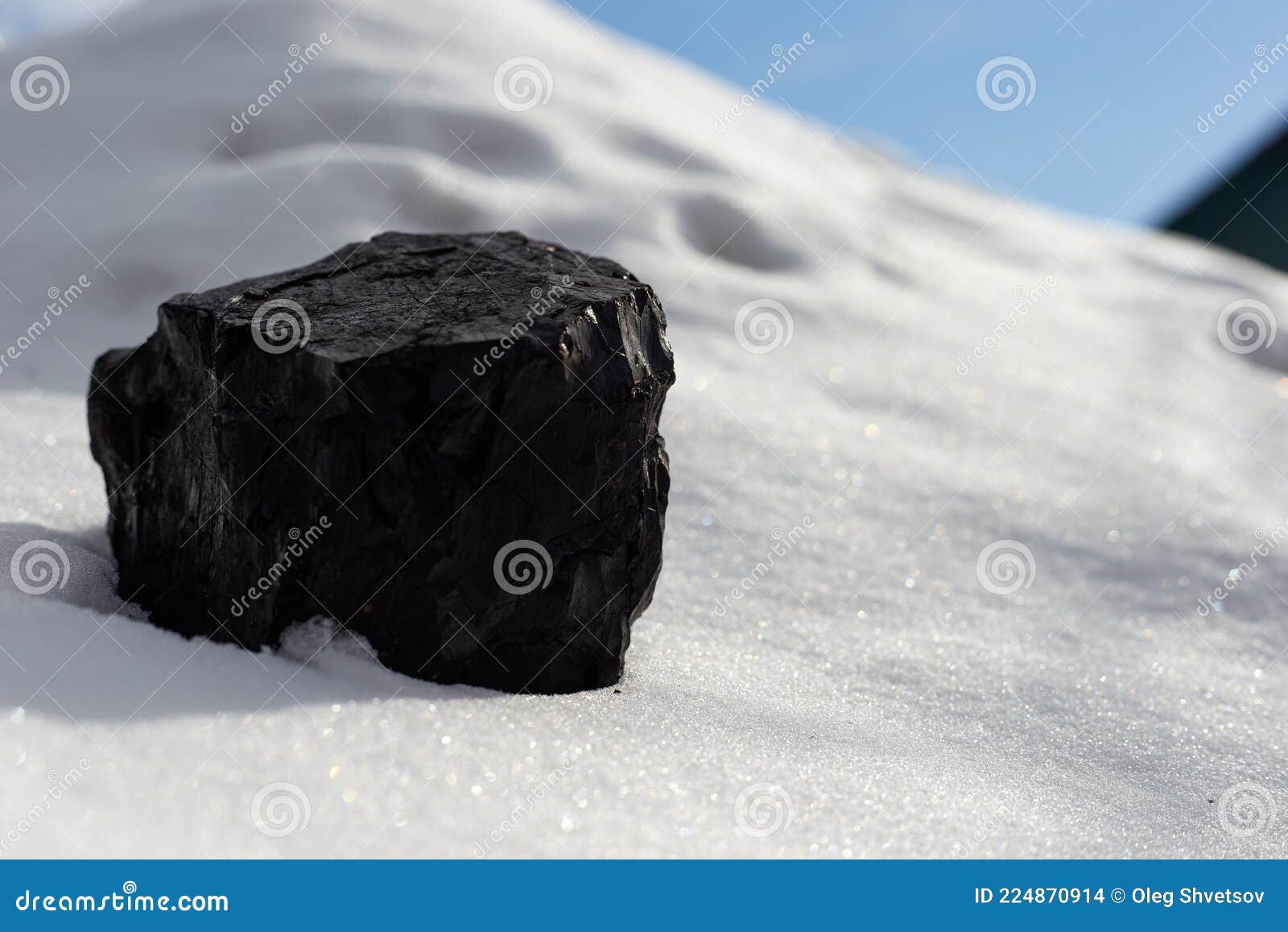 The Coal Stone Lying on the White Snow Symbolizes Energy, Warmth and ...