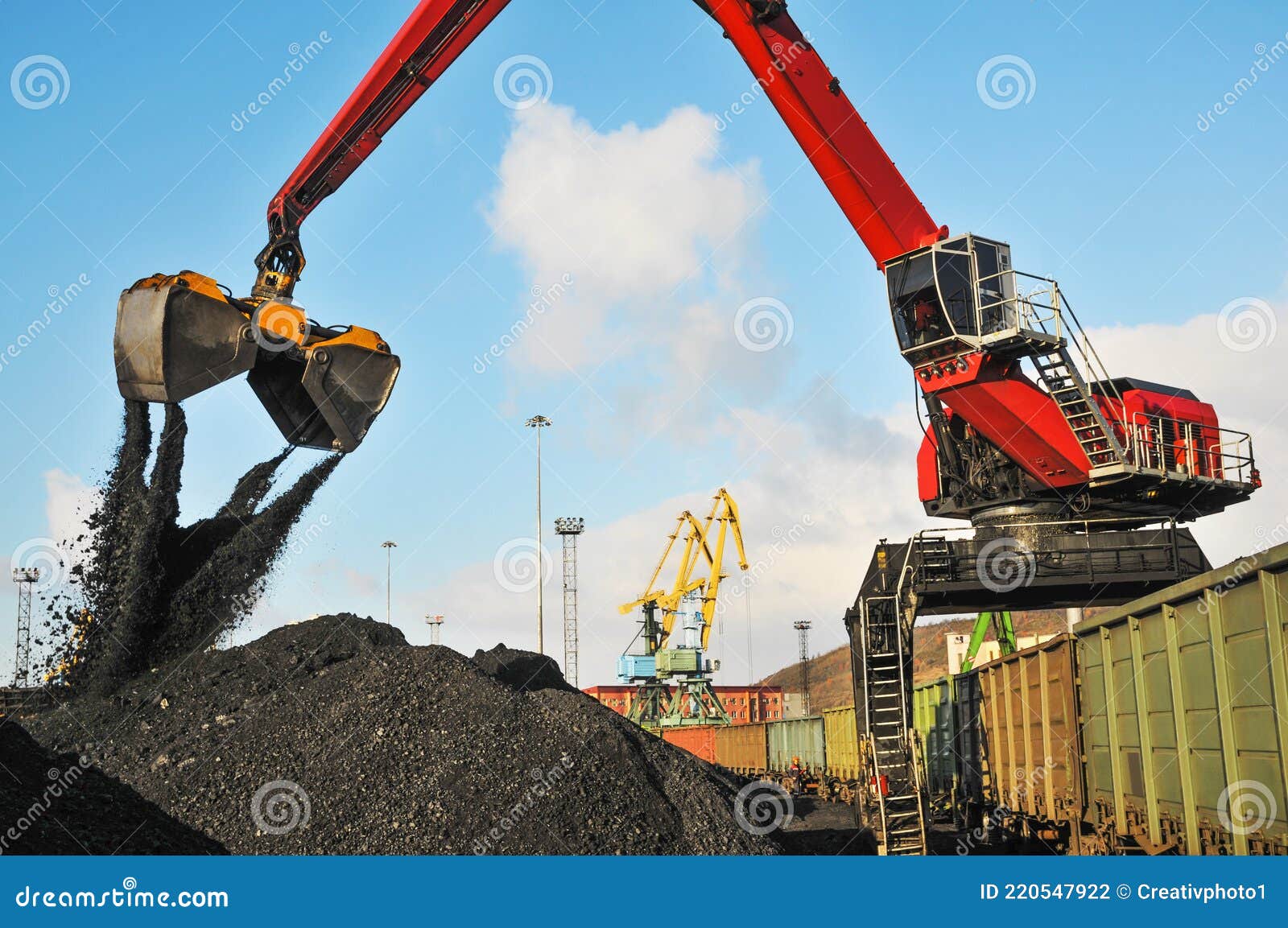 Coal Warehouse in the Seaport. Hydraulic Crane Manipulators Unload Coal ...