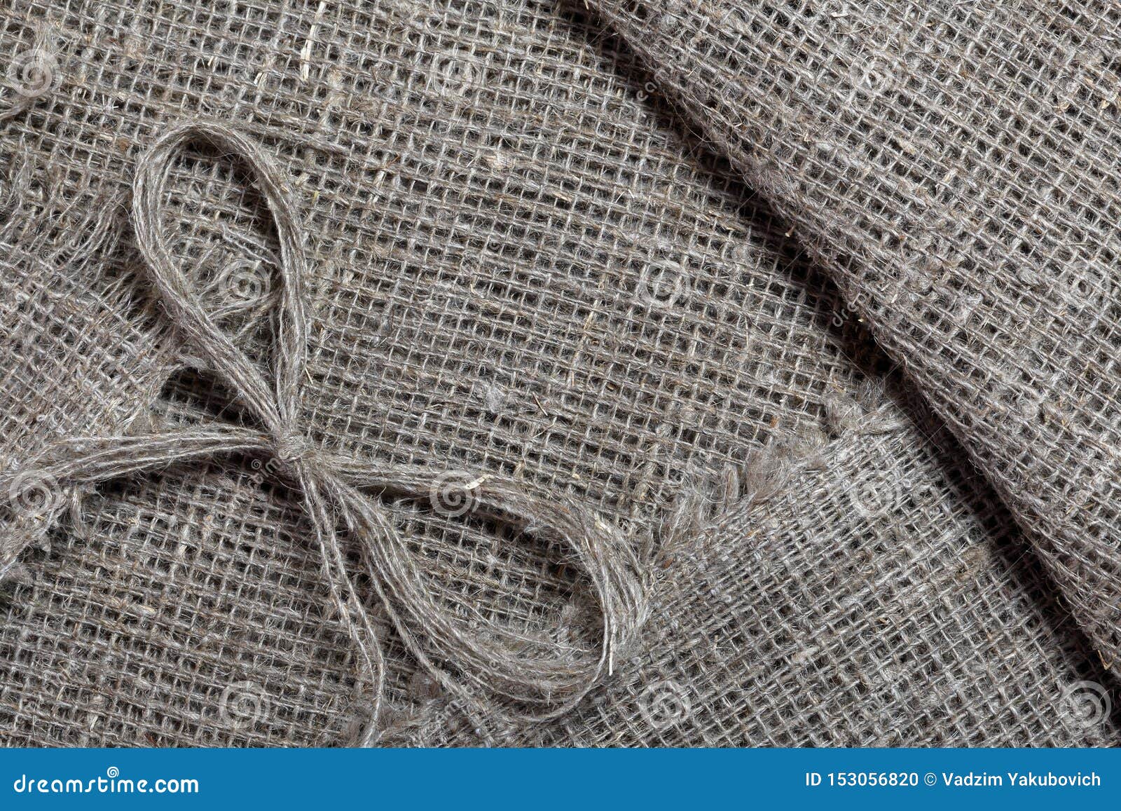 Coarse Linen Fabric. on it Lies a Bow of Linen Thread Stock Photo ...