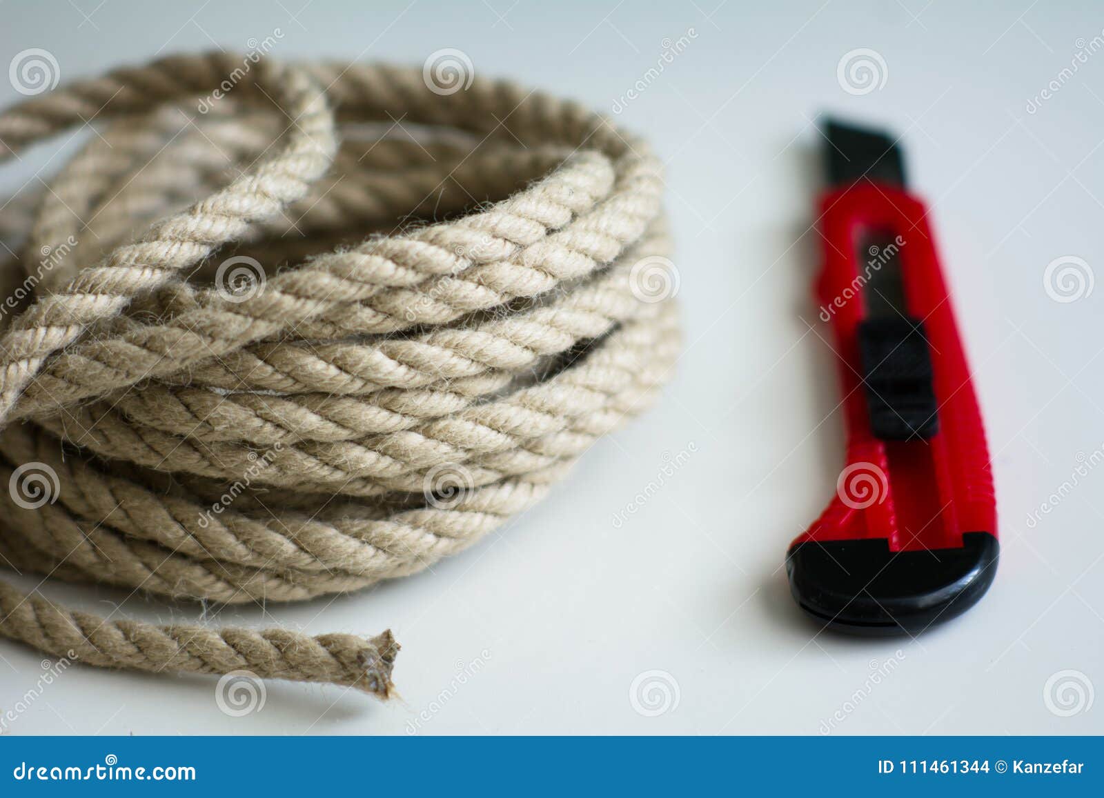Coarse Rope Roll and a Knife with a Red Handle Stock Photo - Image of ...