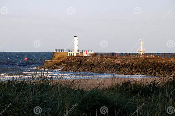 Coastal Beach with Jetty and Harbour Light Stock Image - Image of ...